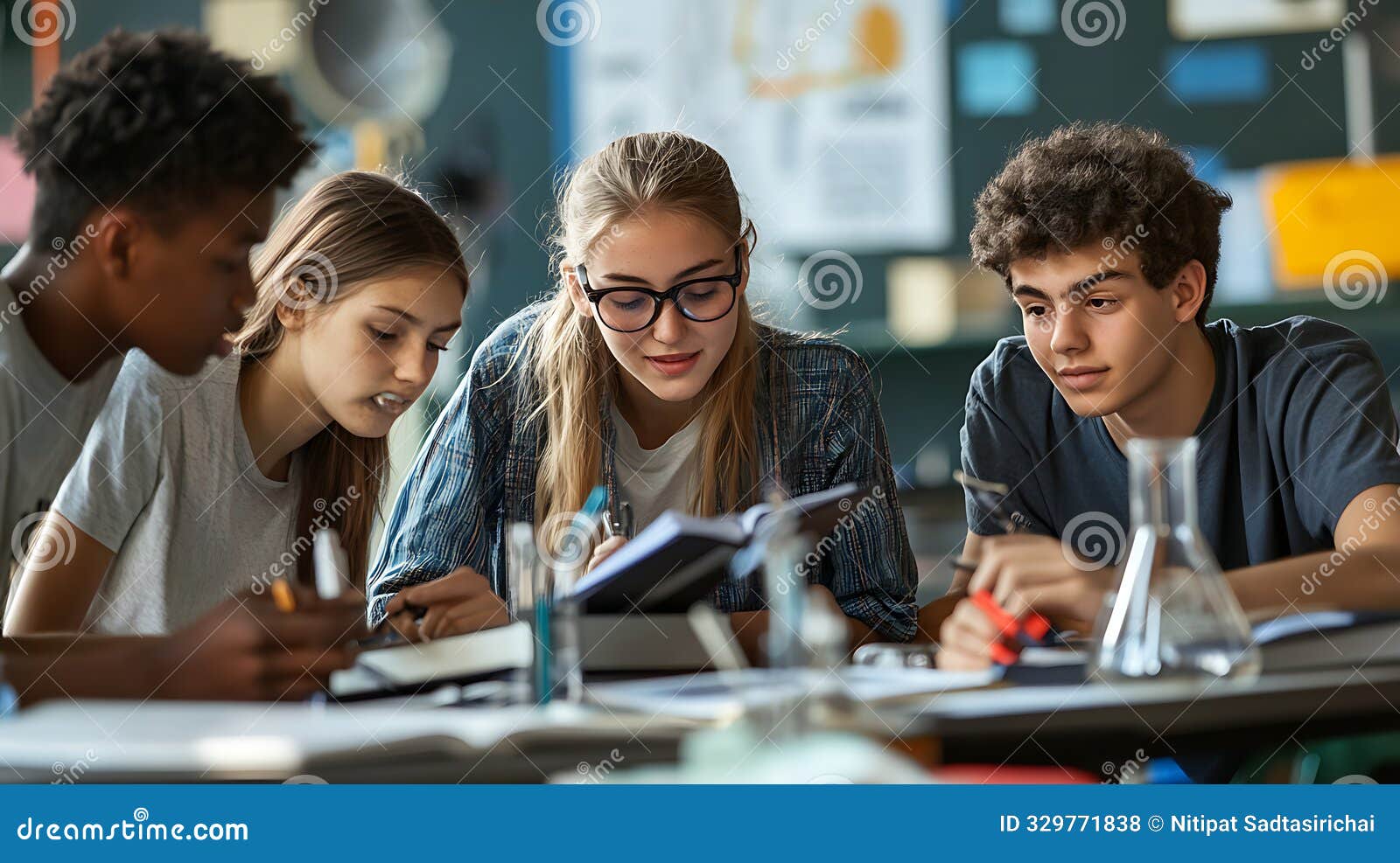 A Group of High School Students Collaborating on a Science Project ...