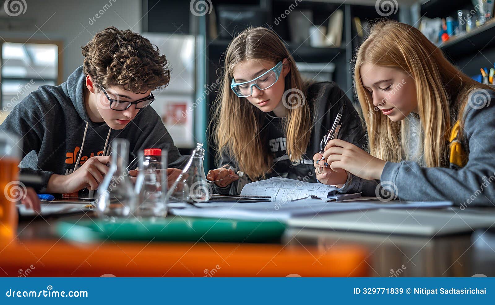 A Group of High School Students Collaborating on a Science Project ...