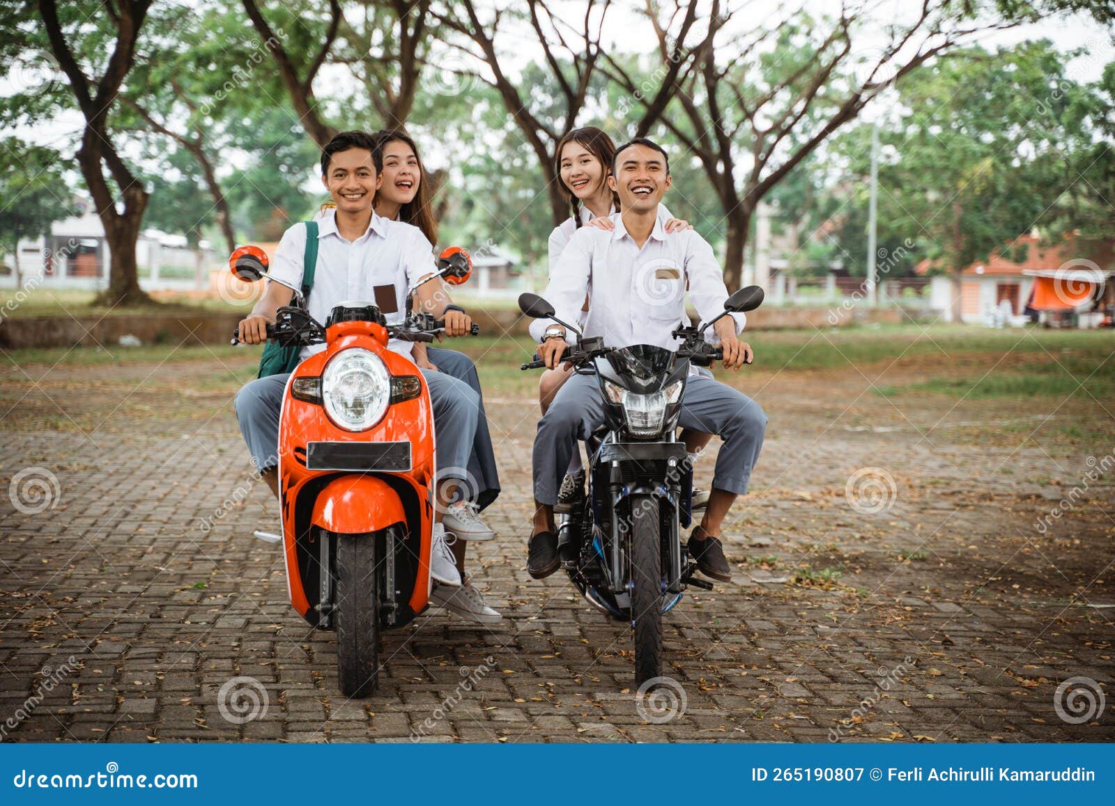 Group of High School Students Riding Motorcycle without a Helmet Stock ...
