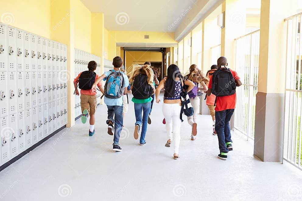 Group of High School Students Running Along Corridor Stock Image ...
