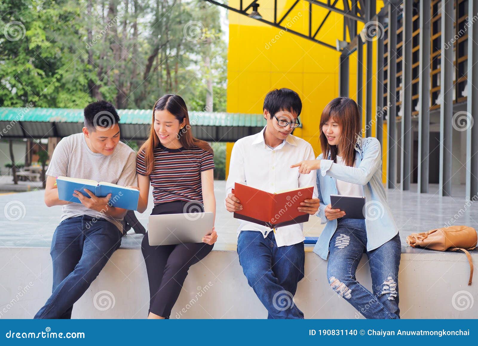 A Group of High School Students Sit Together To Study in the Area of ...