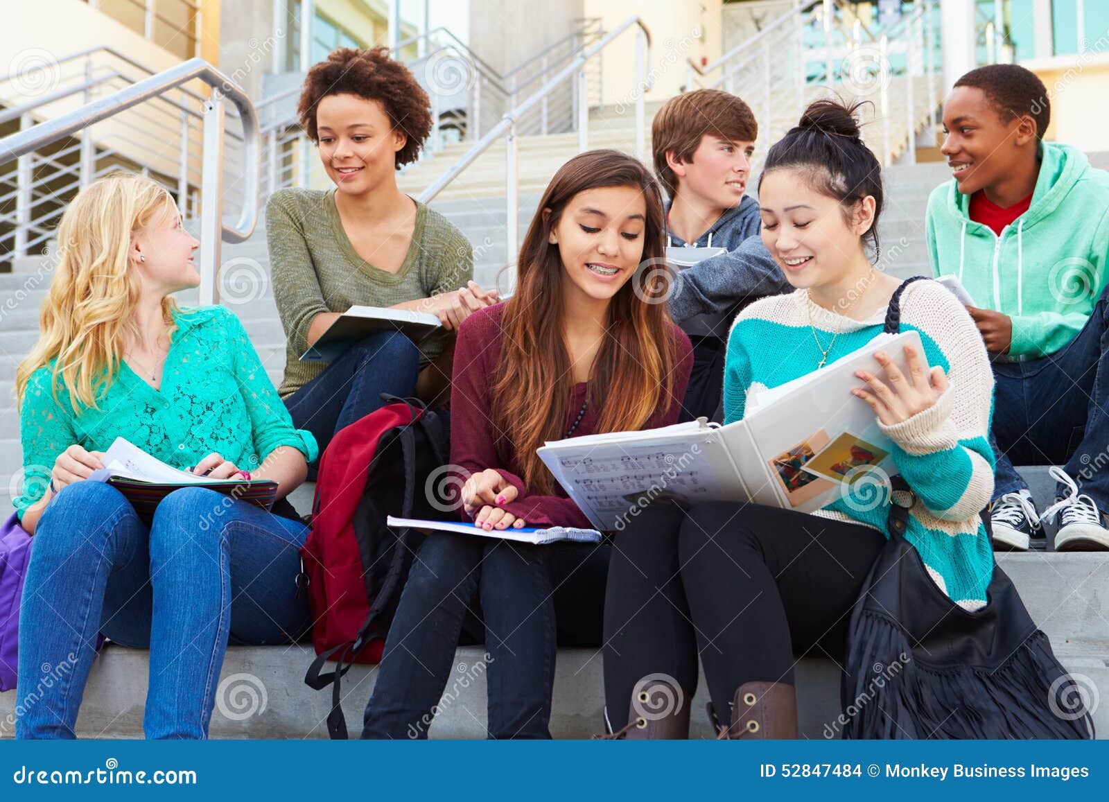 Group of High School Students Sitting Outside Building Stock Photo ...
