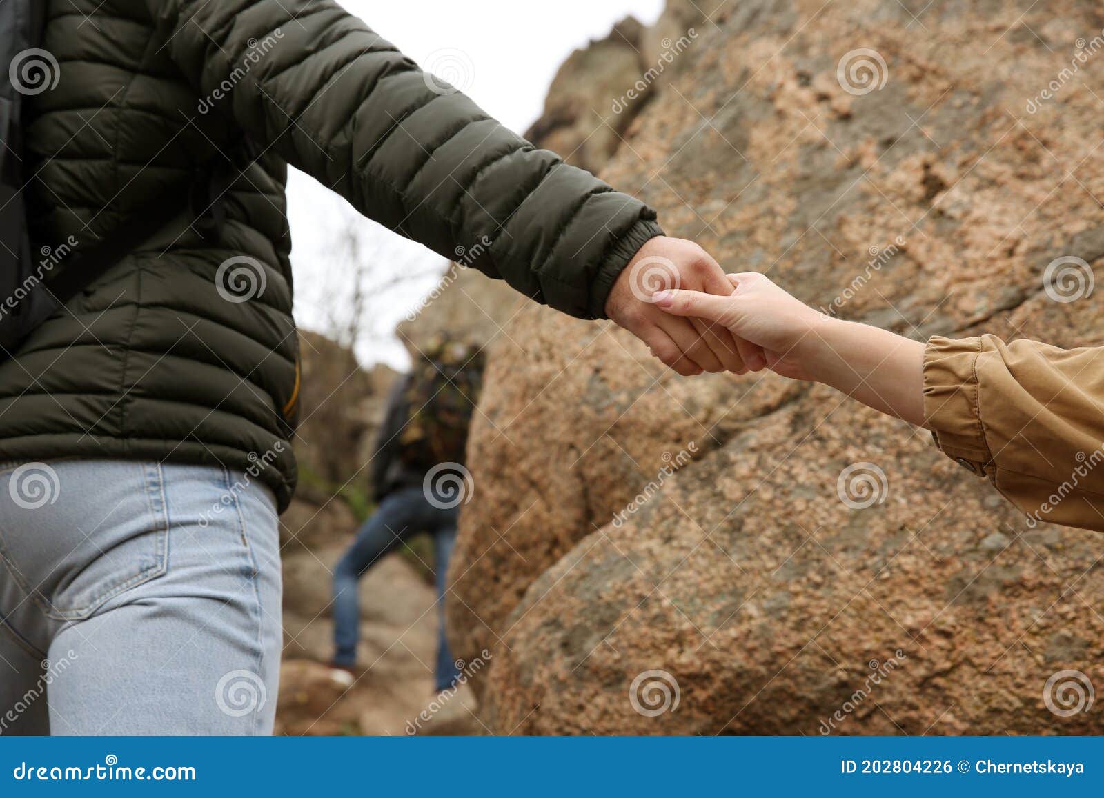 Group of Hikers Climbing Up Mountain, Closeup of Hands Stock Photo ...