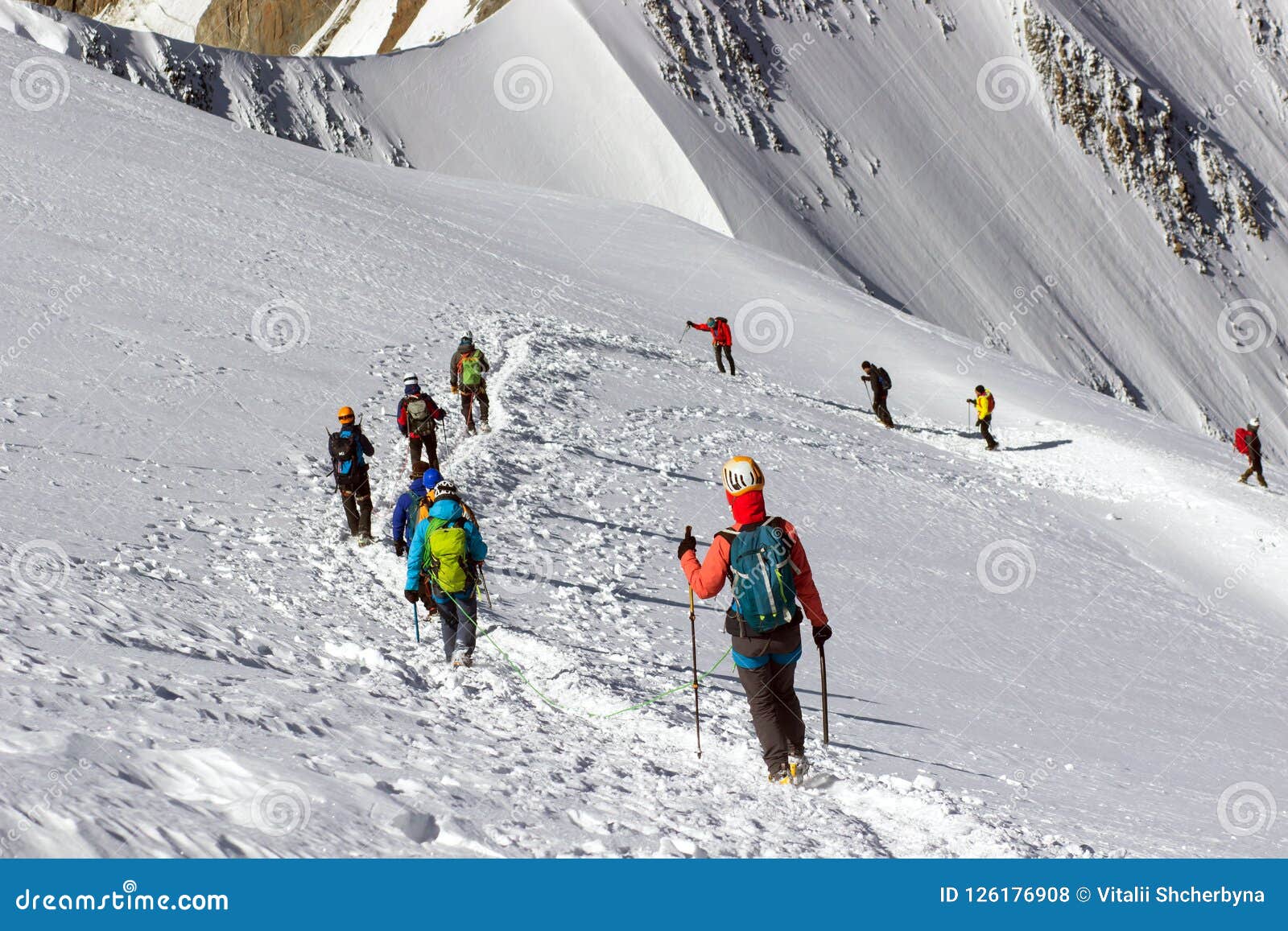 Group of Hikers Going Down a Hill Stock Photo - Image of snow, ridge ...