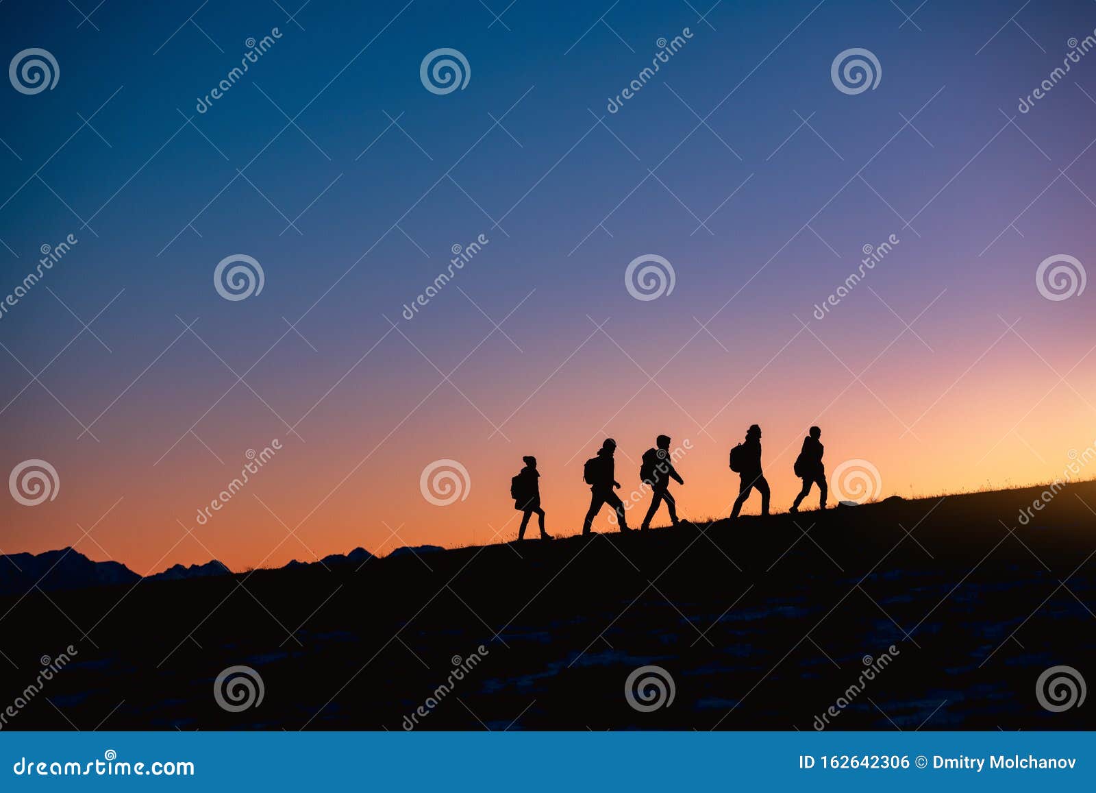 Group of Hikers at Sunset Mountain Stock Photo - Image of beauty ...