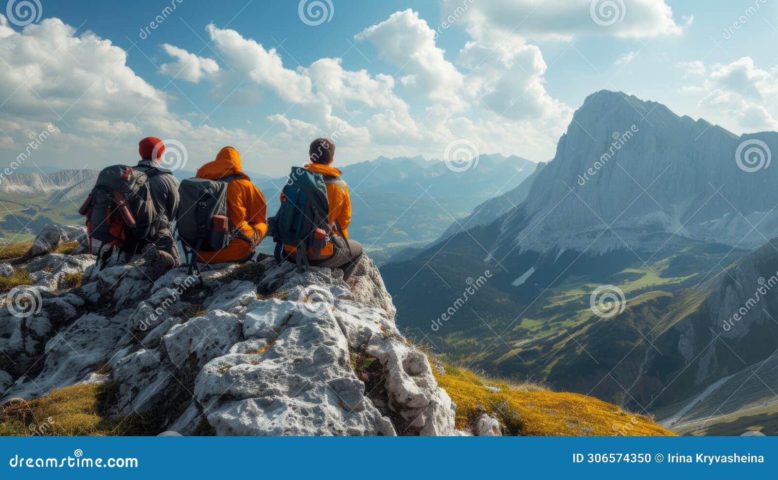 A Group of Hikers Taking a Break on a Rocky Mountaintop, Enjoying a ...