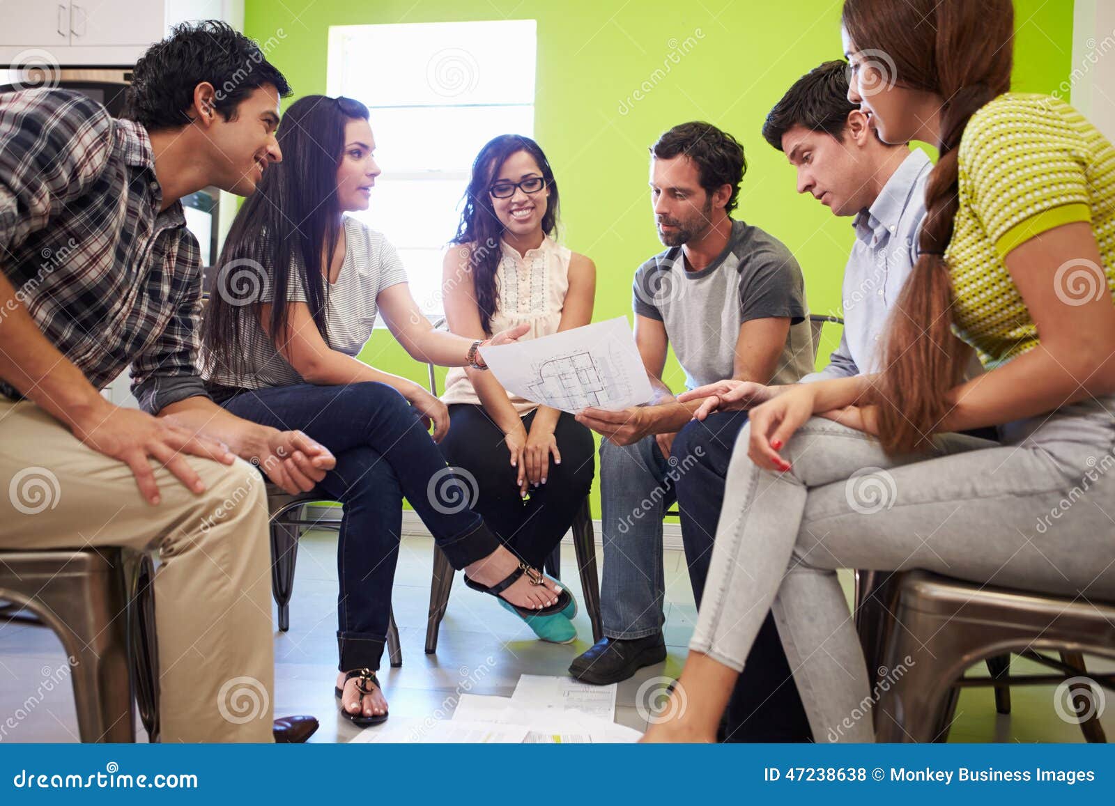 Group of Hispanic Designers Meeting To Discuss New Ideas Stock Photo ...