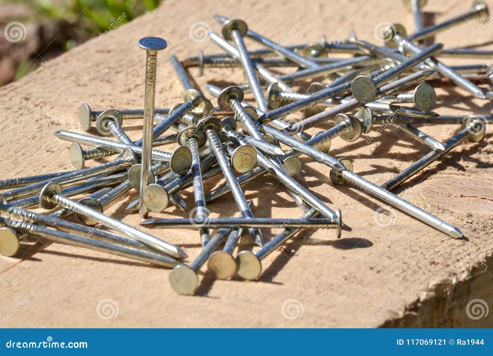 Group Hobnails on a Wooden Board. Close-up Stock Image - Image of ...