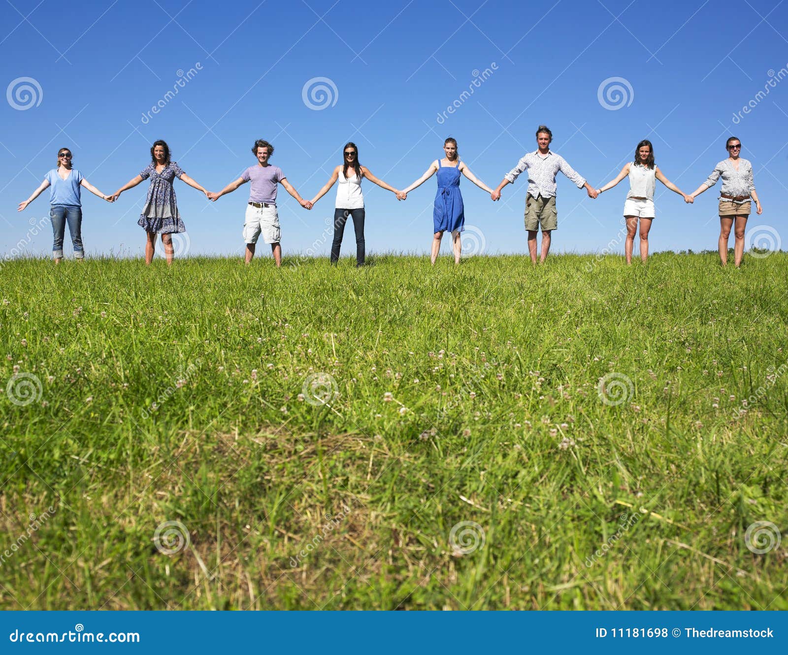 Group Holding hands stock photo. Image of grass, meadow - 11181698
