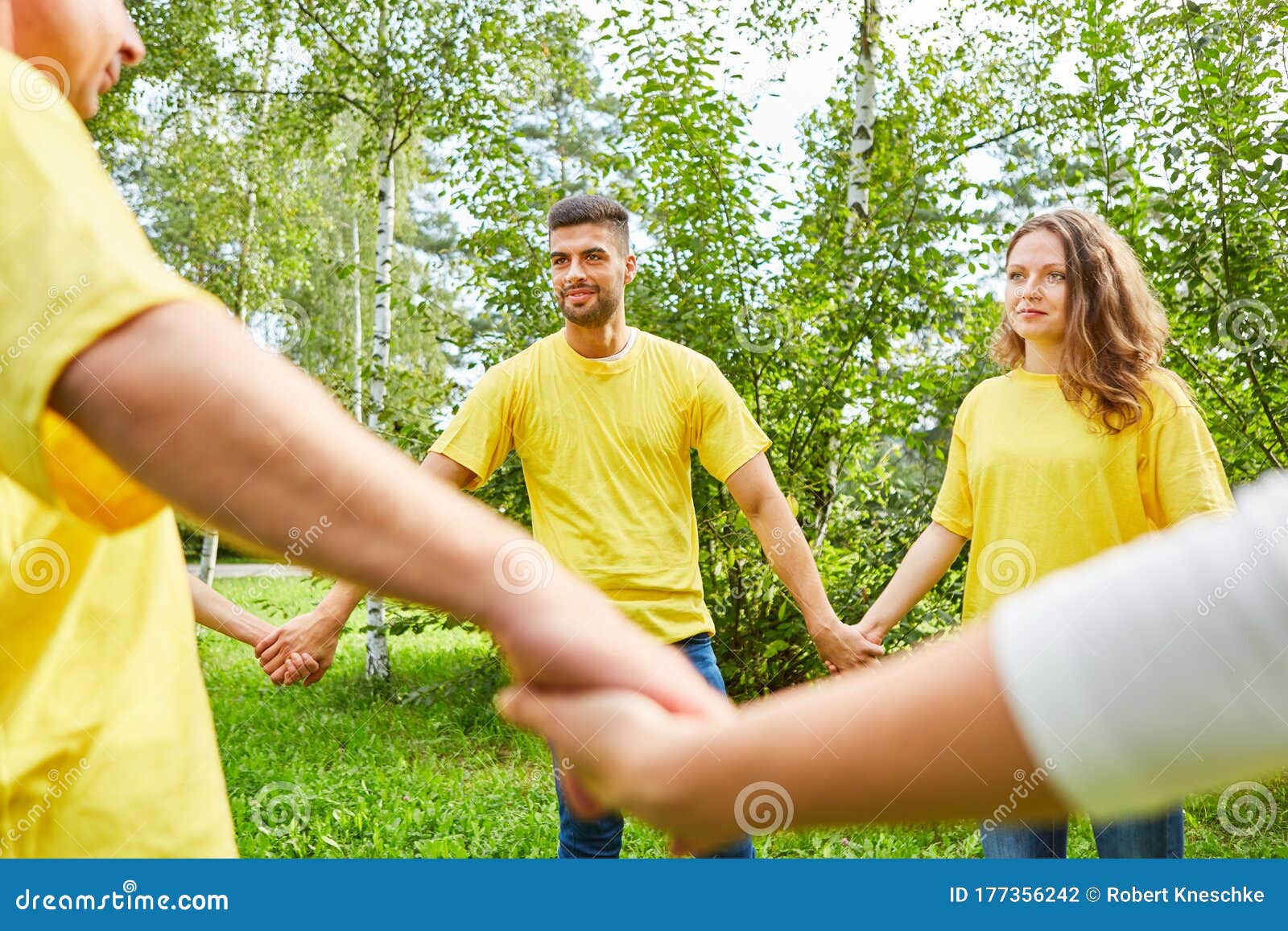 Group Holding Hands at Team Building Event Stock Photo - Image of ...
