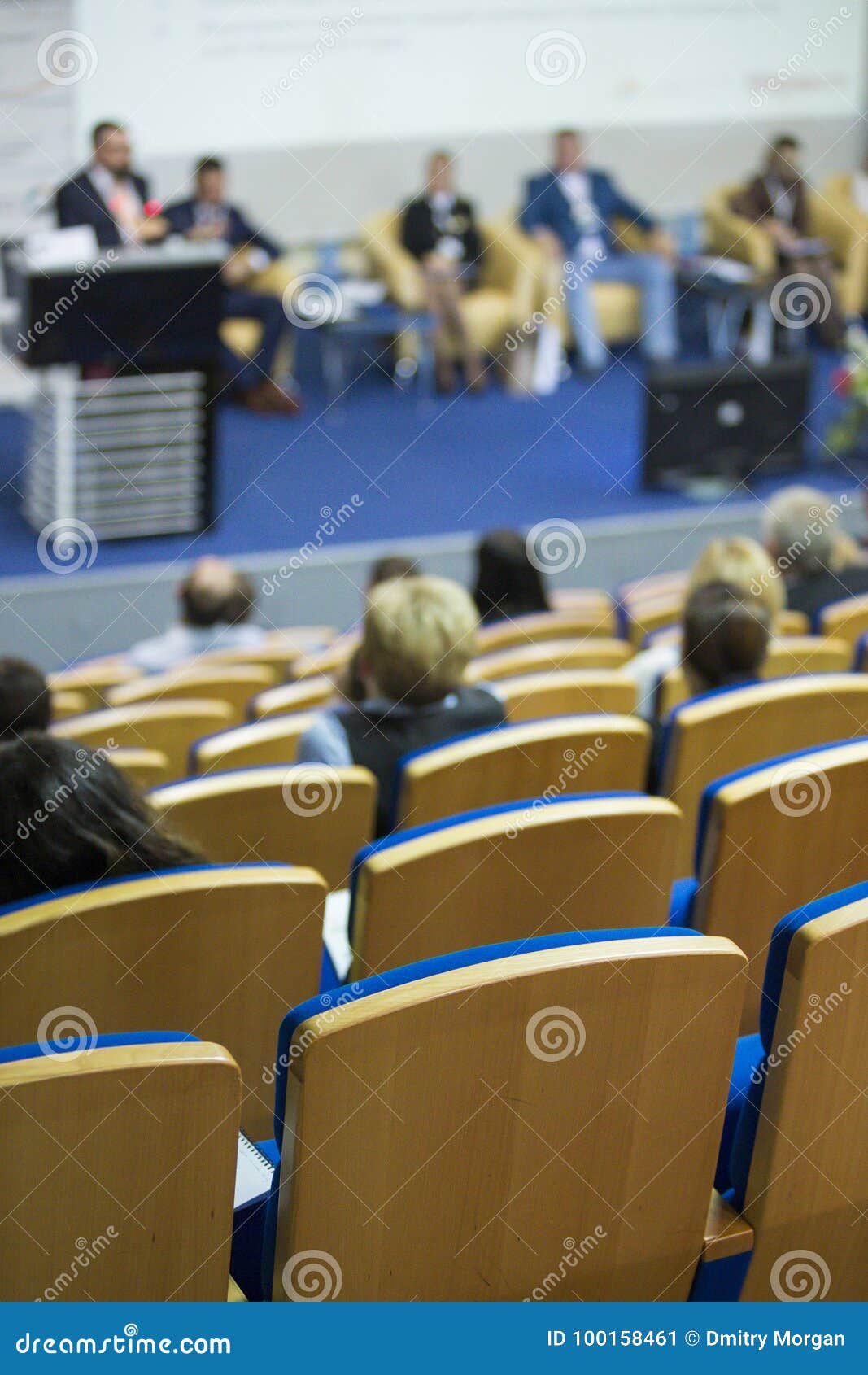 Group of Hosts Sitting on Stage at Table during a Conference. Stock ...