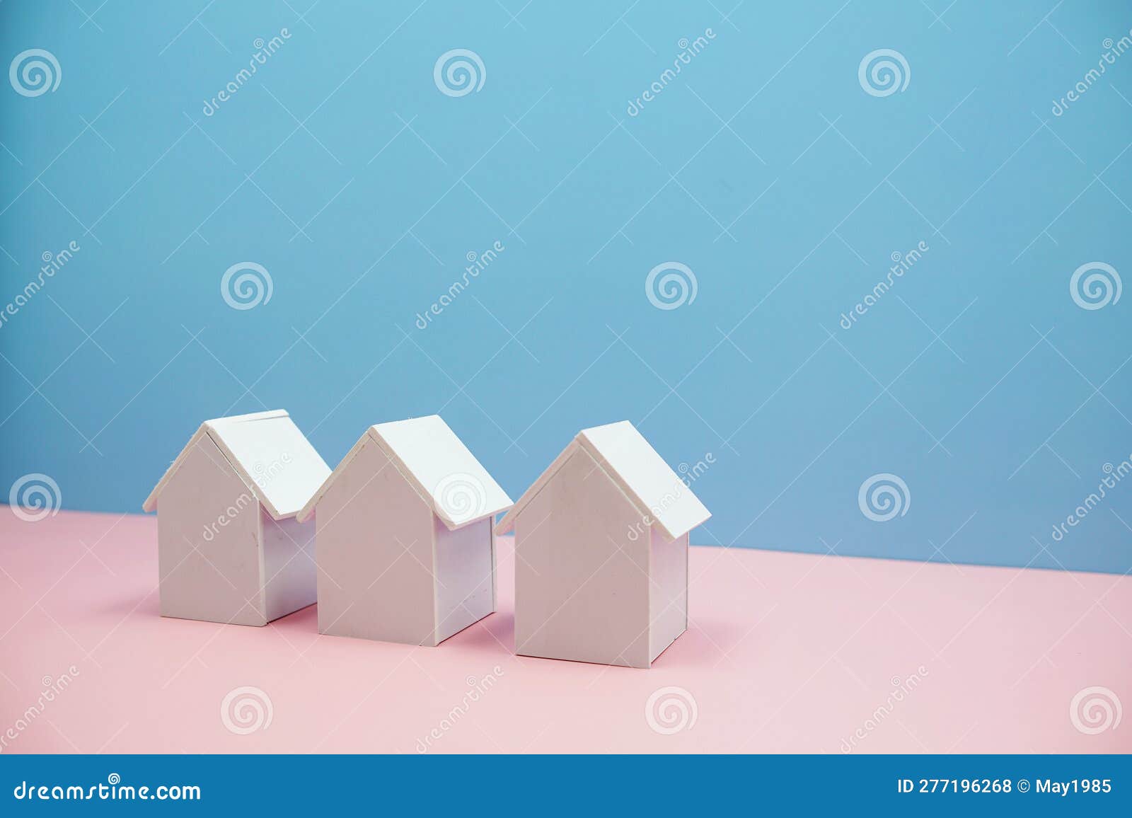 Group of House Model Isolated with Space for Copy on Blue and Pink ...
