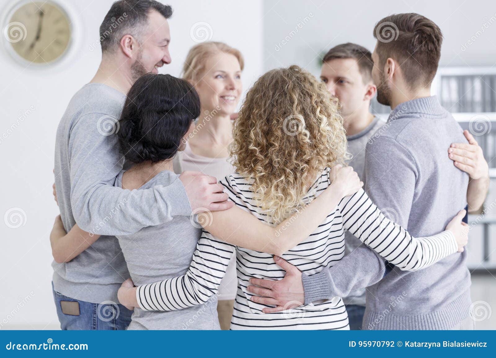 Group hug during therapy stock photo. Image of psychologist - 95970792