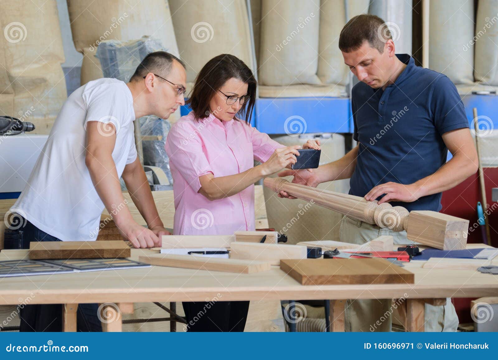Group of Industrial People Working Together, Teamwork in Carpentry ...