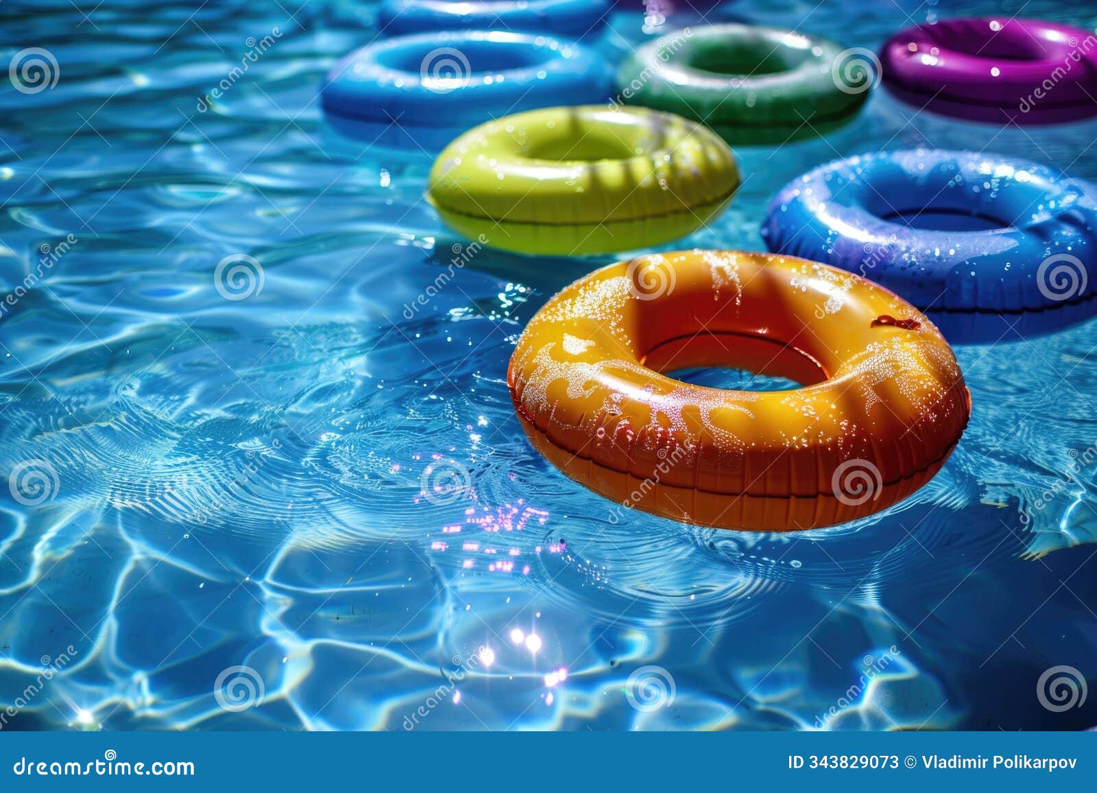 Group of Inflatables Float on the Surface of a Swimming Pool Stock ...