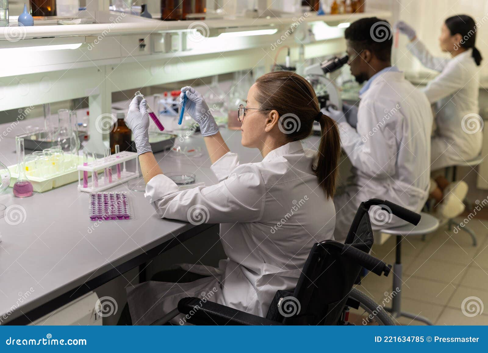 Group of Intercultural Lab Workers Sitting in Row Stock Image - Image ...