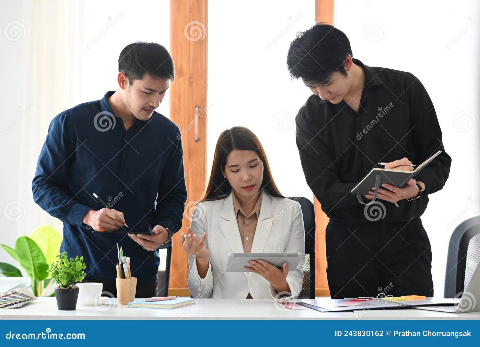 Interior Designer Collaborating on a New Project at Creative Office ...