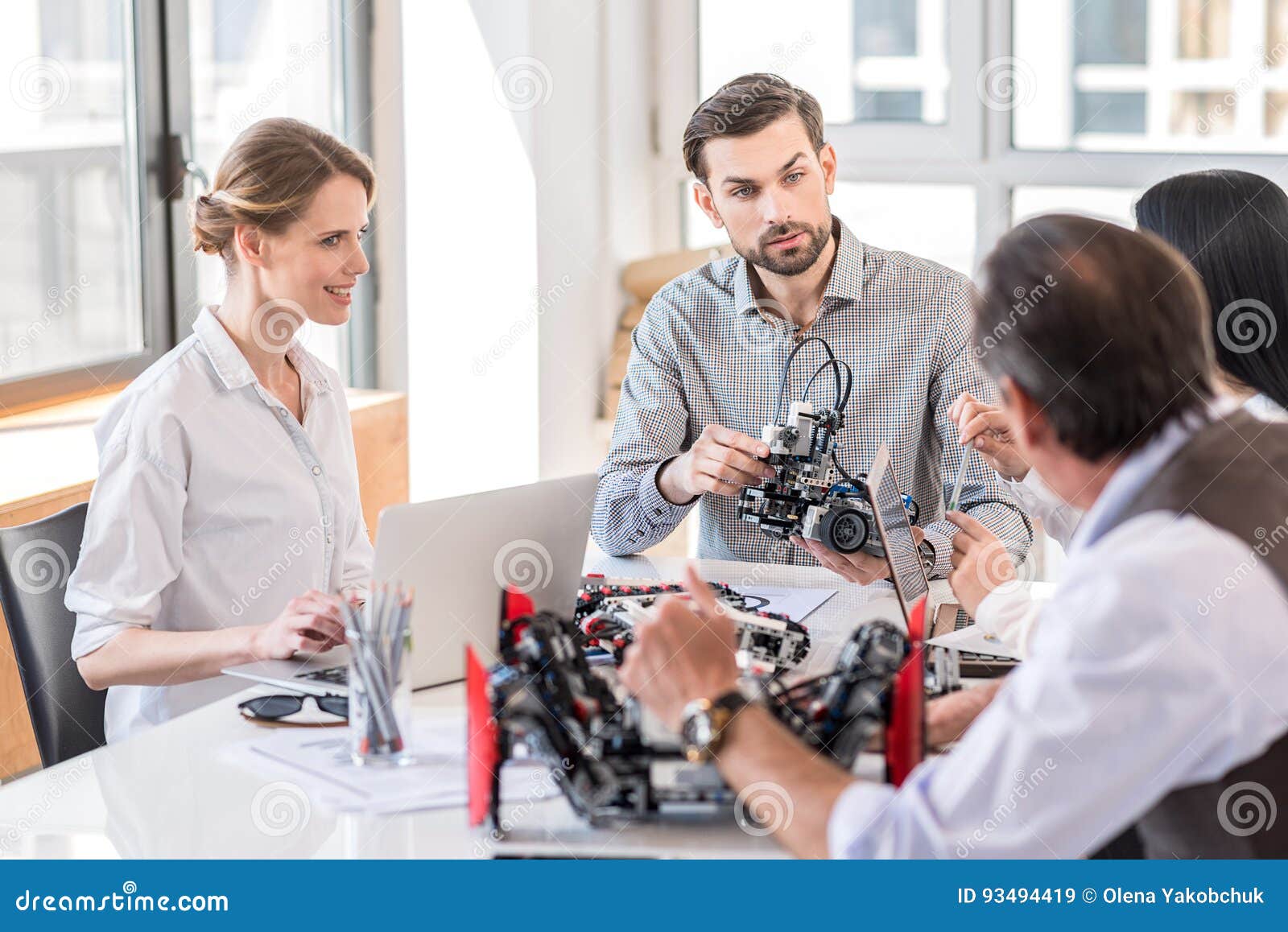 Group of Inventors Discussing in Office Stock Image - Image of layout ...
