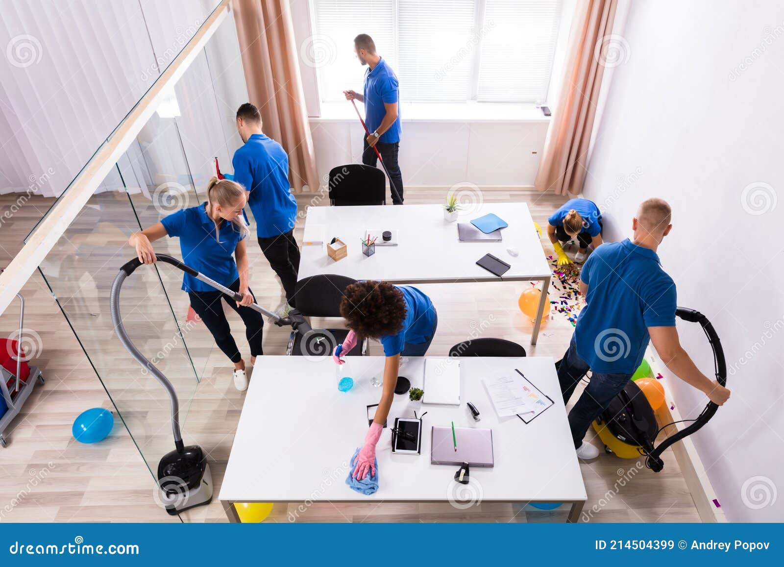 Group of Janitors Cleaning Office with Cleaning Equipment Stock Image ...