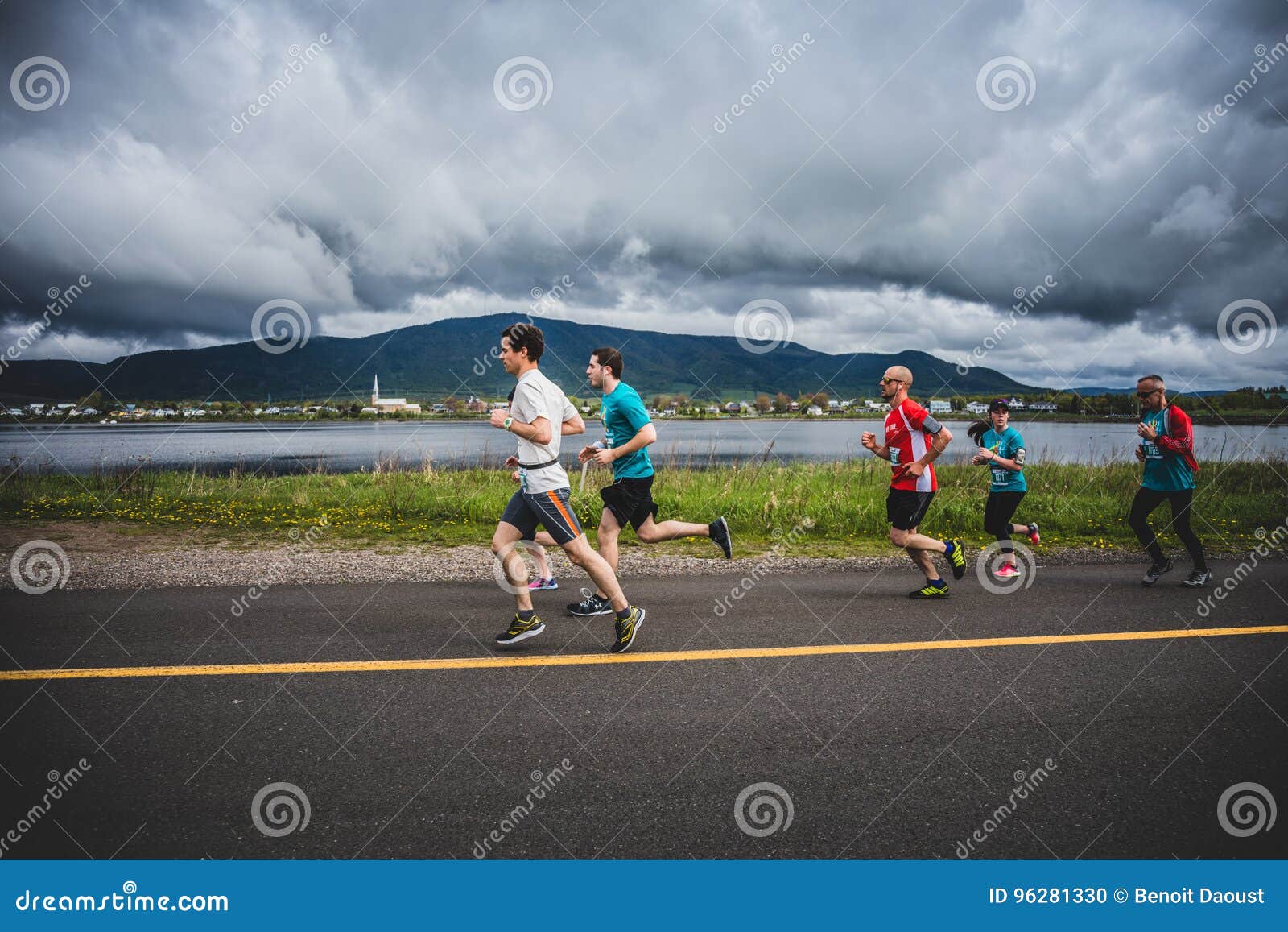 Group of 10K Runners in Front of a Beautiful Mountain Landscape ...