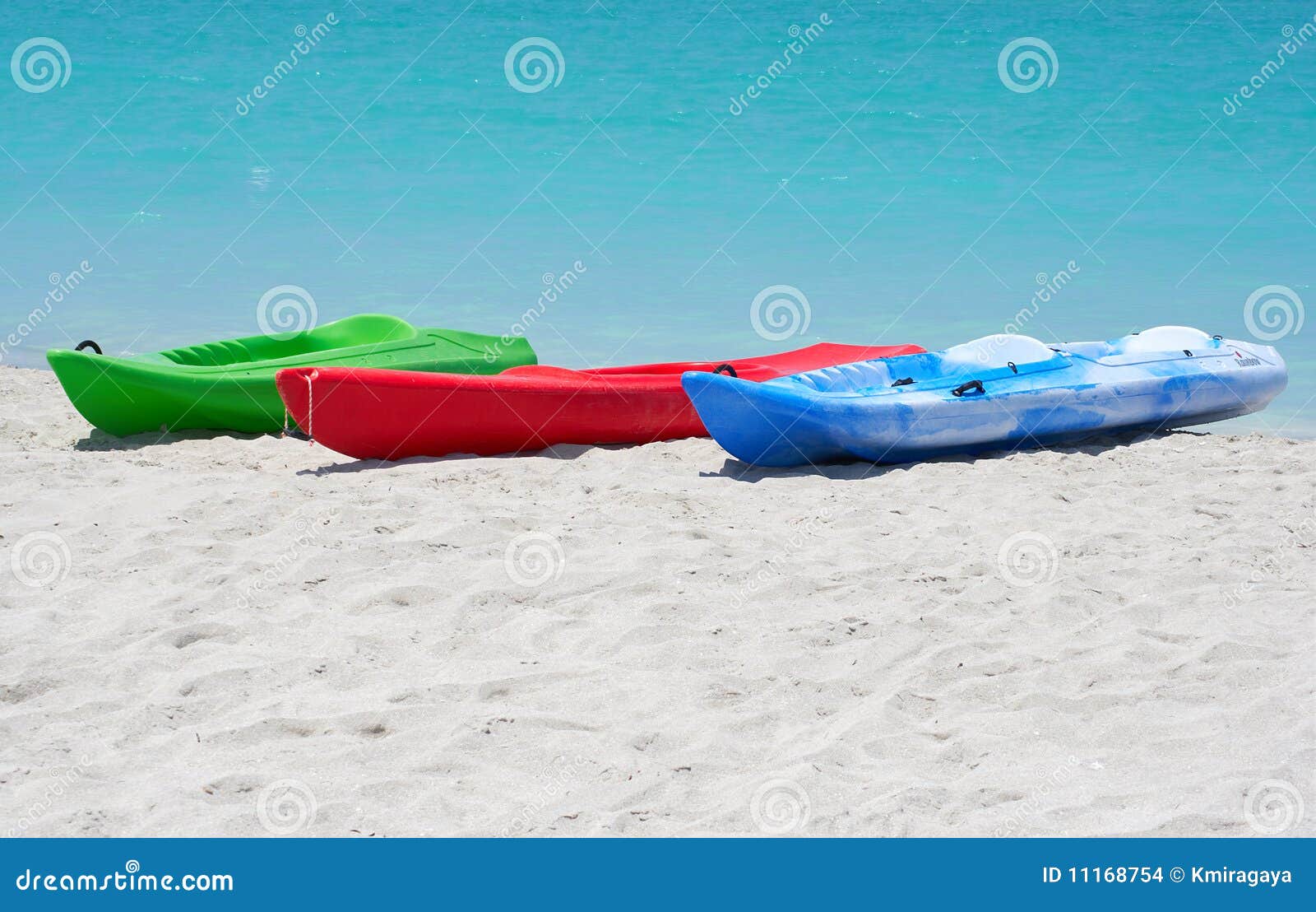 Group of kayaks in a beach stock photo. Image of landscape - 11168754