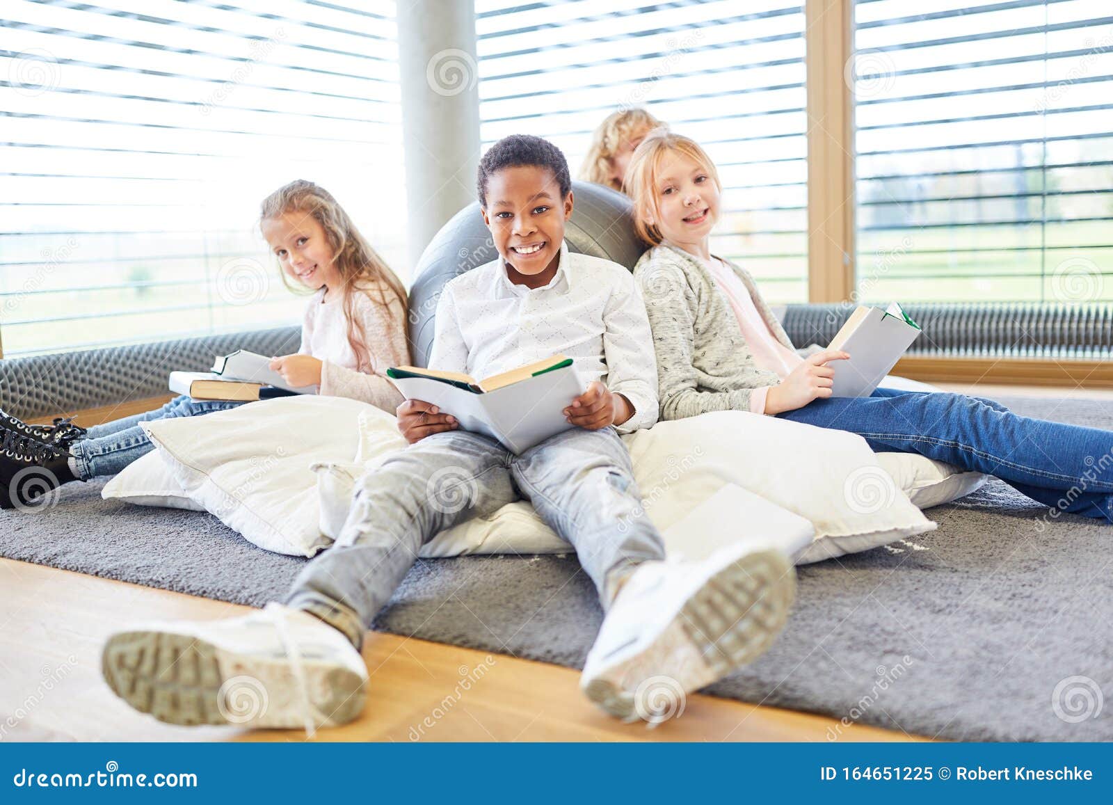 Group of Kids Reading Relaxed Stock Image - Image of group, pupil ...