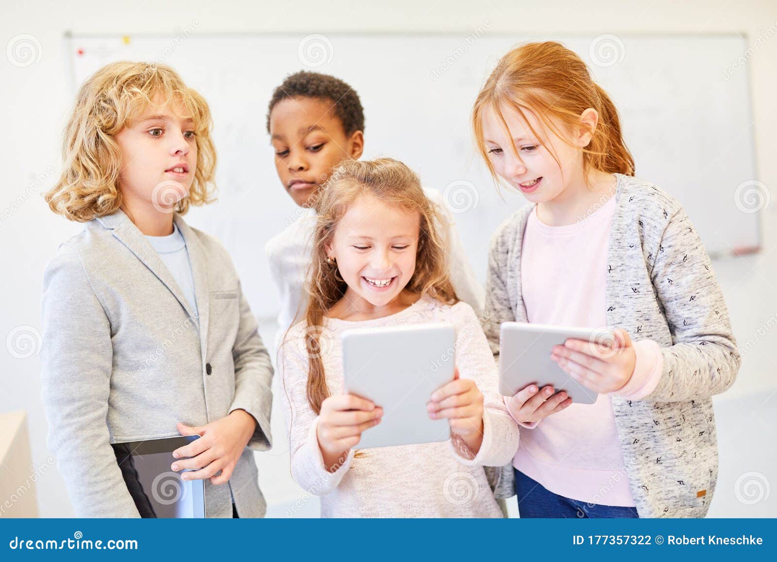 Group of Kids in Elementary School Using Tablet Computer Stock Photo ...