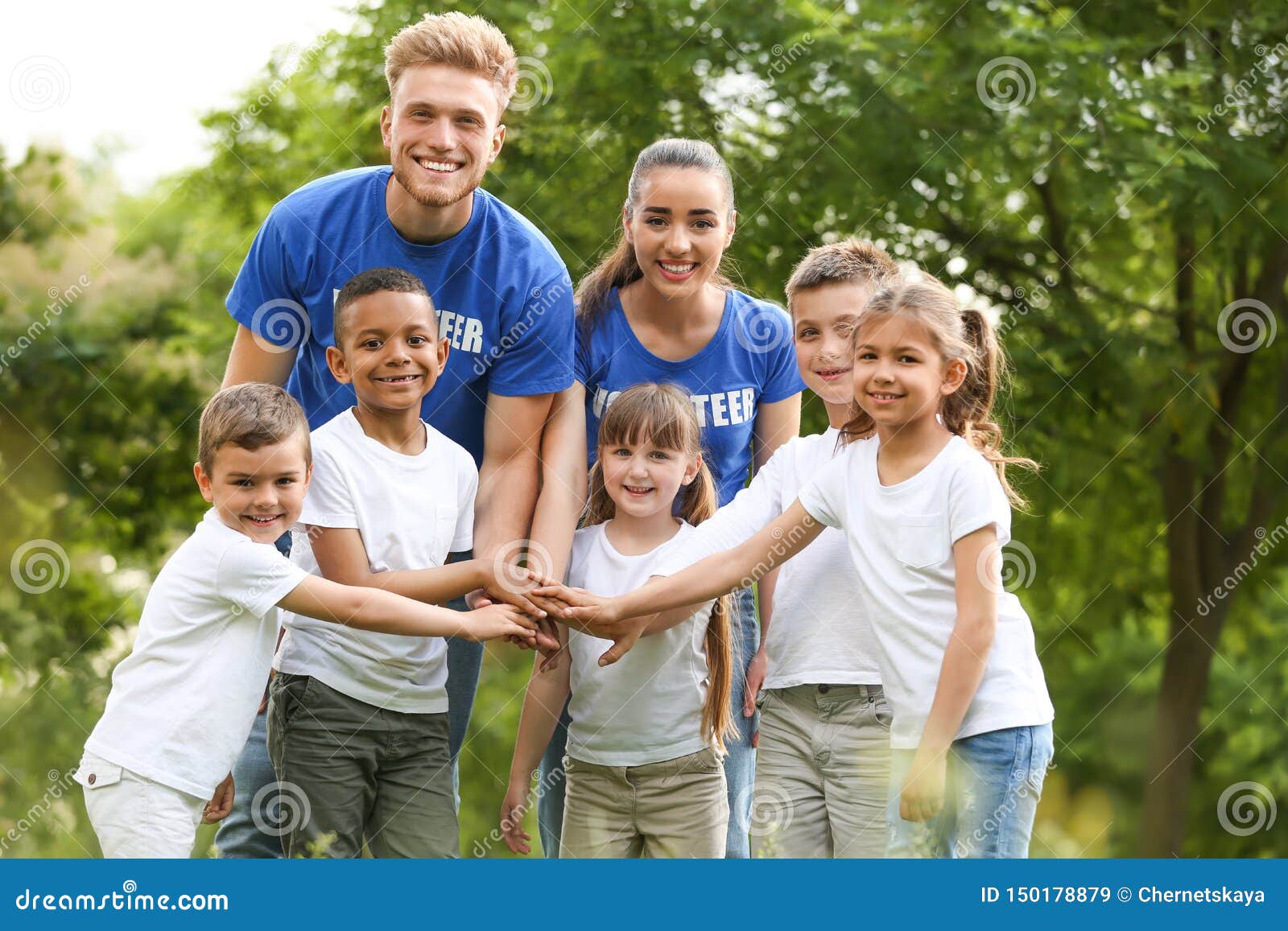 Group of Kids Joining Hands with Volunteers Stock Image - Image of ...