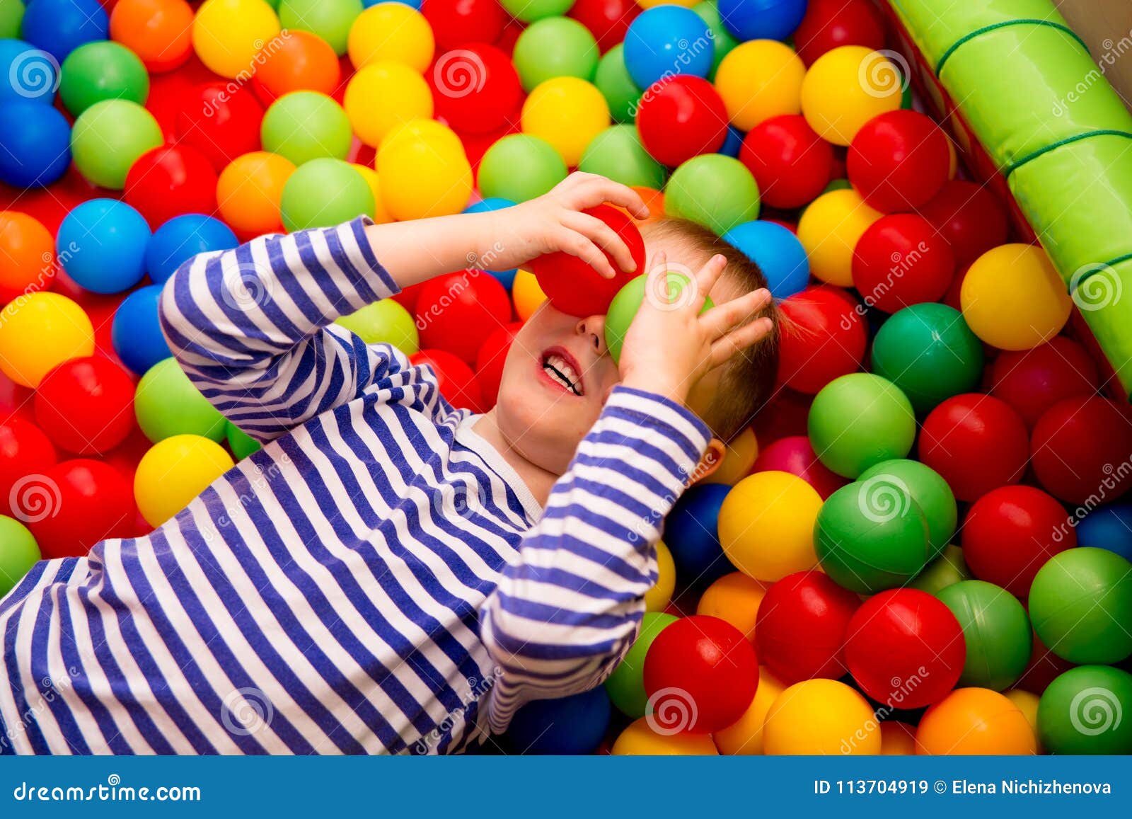 Kids Playing in a Pool of Balls Stock Image - Image of indoors ...