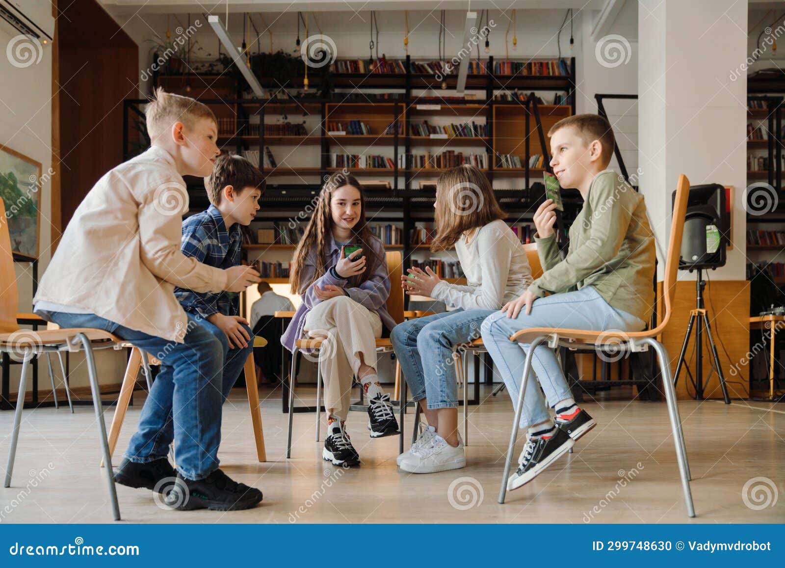 Group of Kids Playing Educational Card Game while Sitting in Library ...