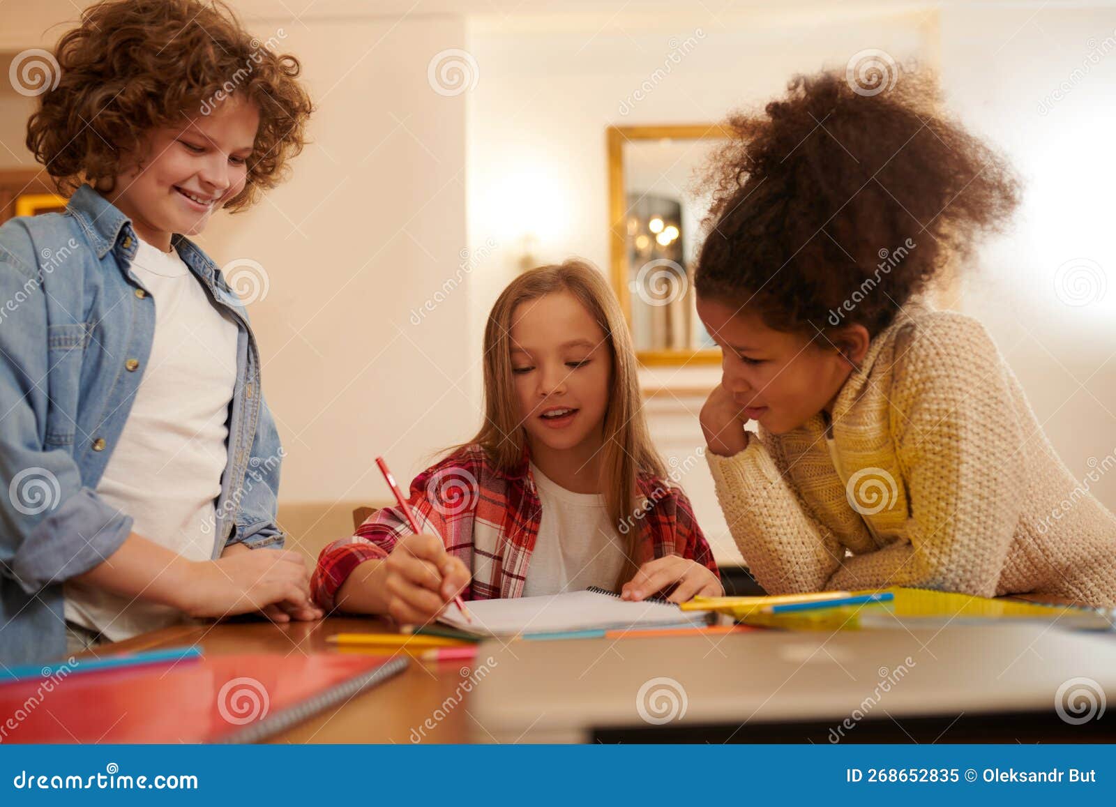 A Group of Kids Preparing Home Work Together and Helping the Classmate ...