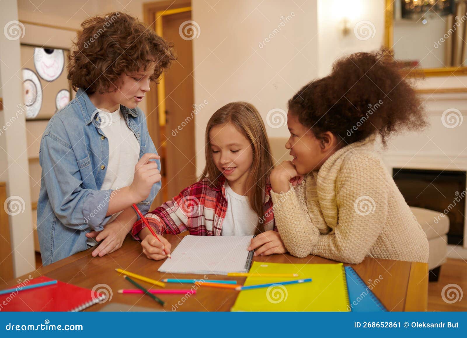 A Group of Kids Preparing Home Work Together and Helping the Classmate ...
