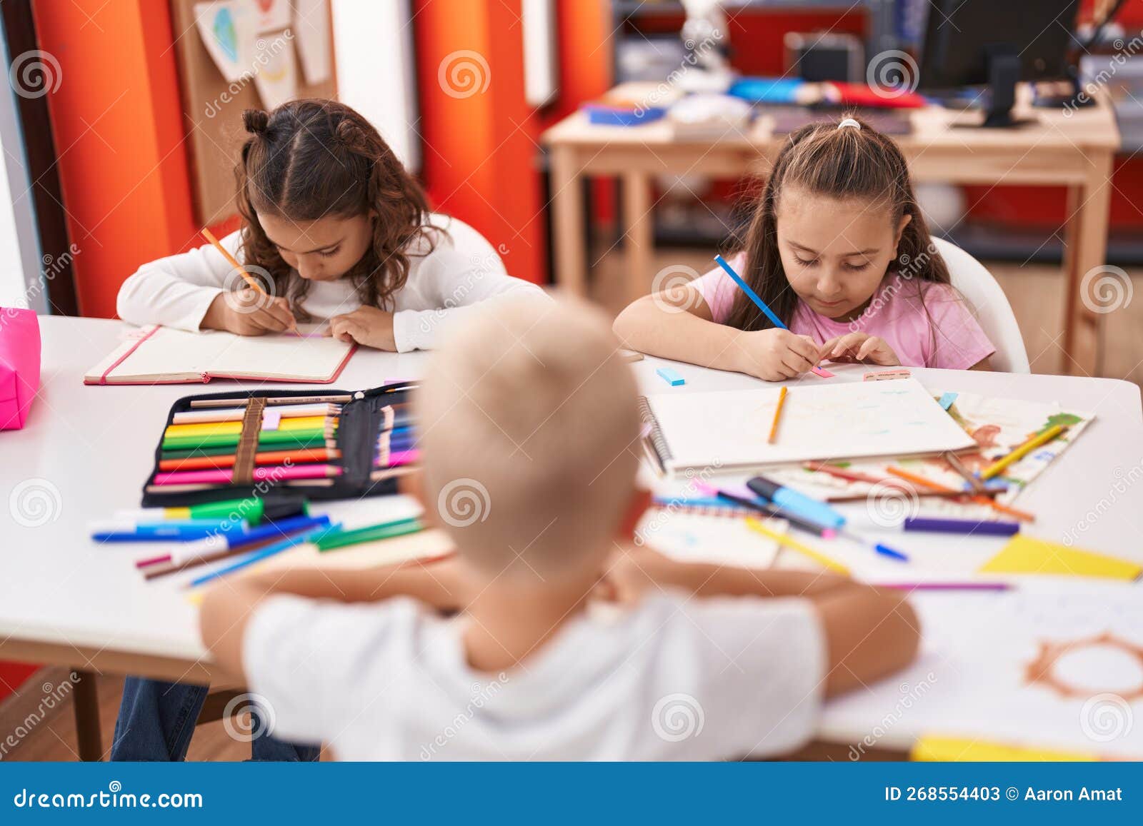 Group of Kids Preschool Students Sitting on Table Drawing on Paper at ...