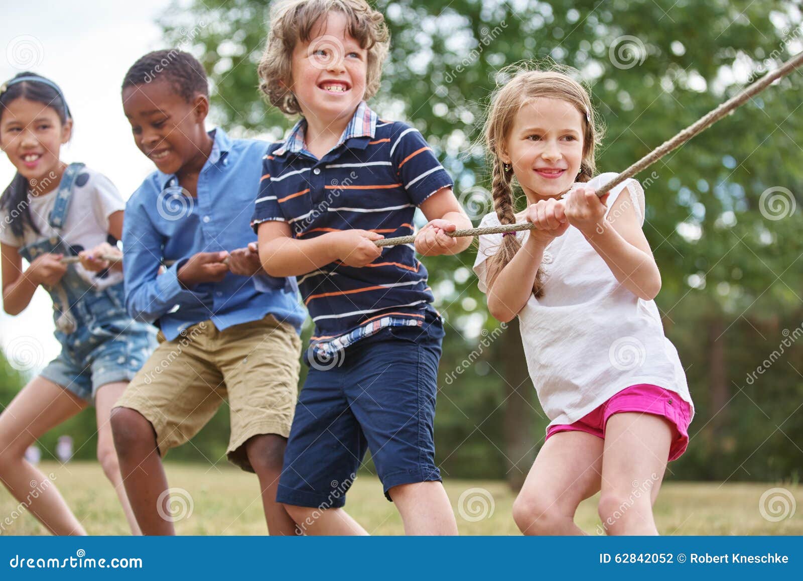 Group of Kids Pulling a Rope Stock Photo - Image of stand, carefree ...