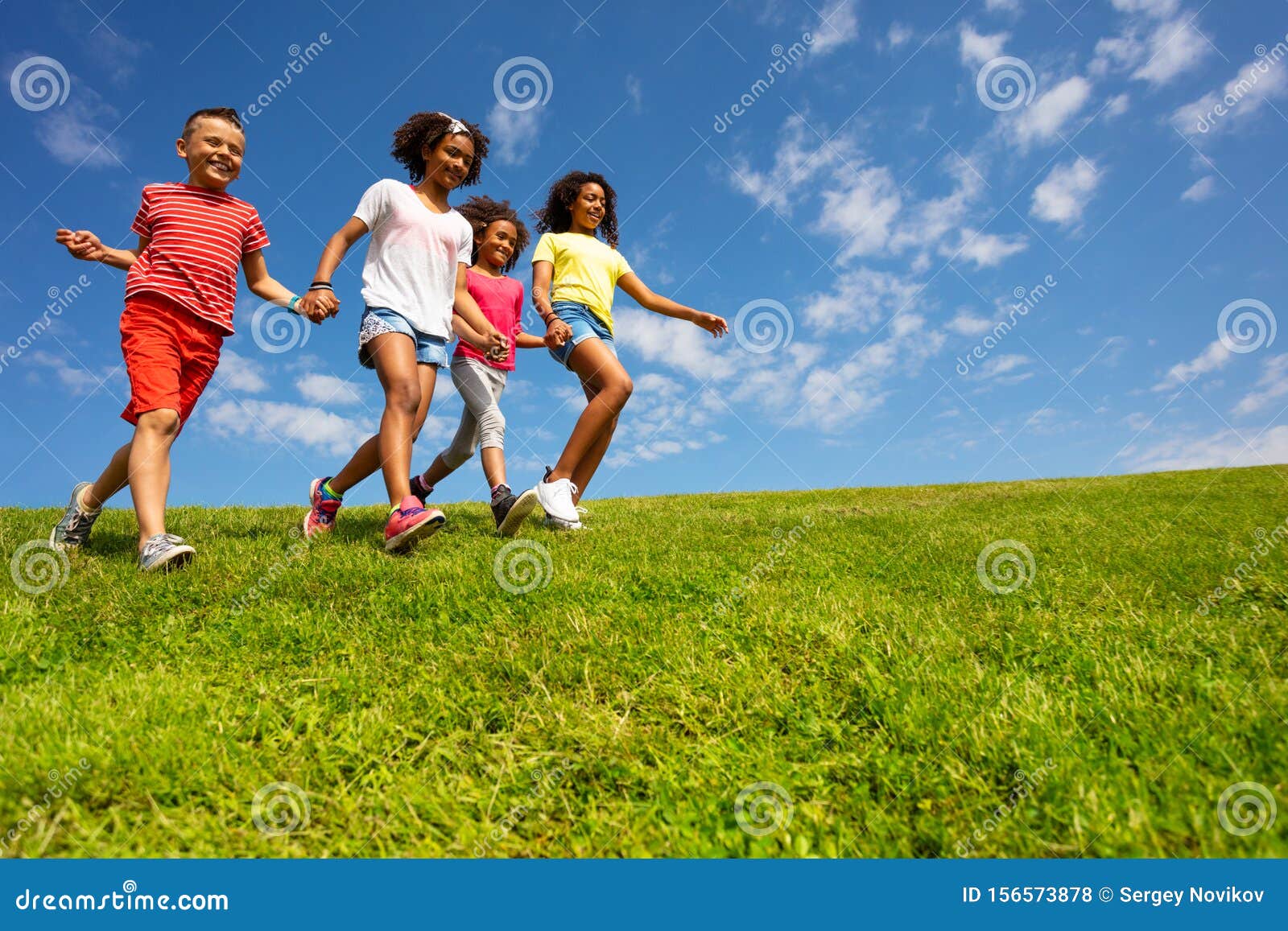 Group of Kids Run on the Grass Field Holding Hands Stock Photo - Image ...