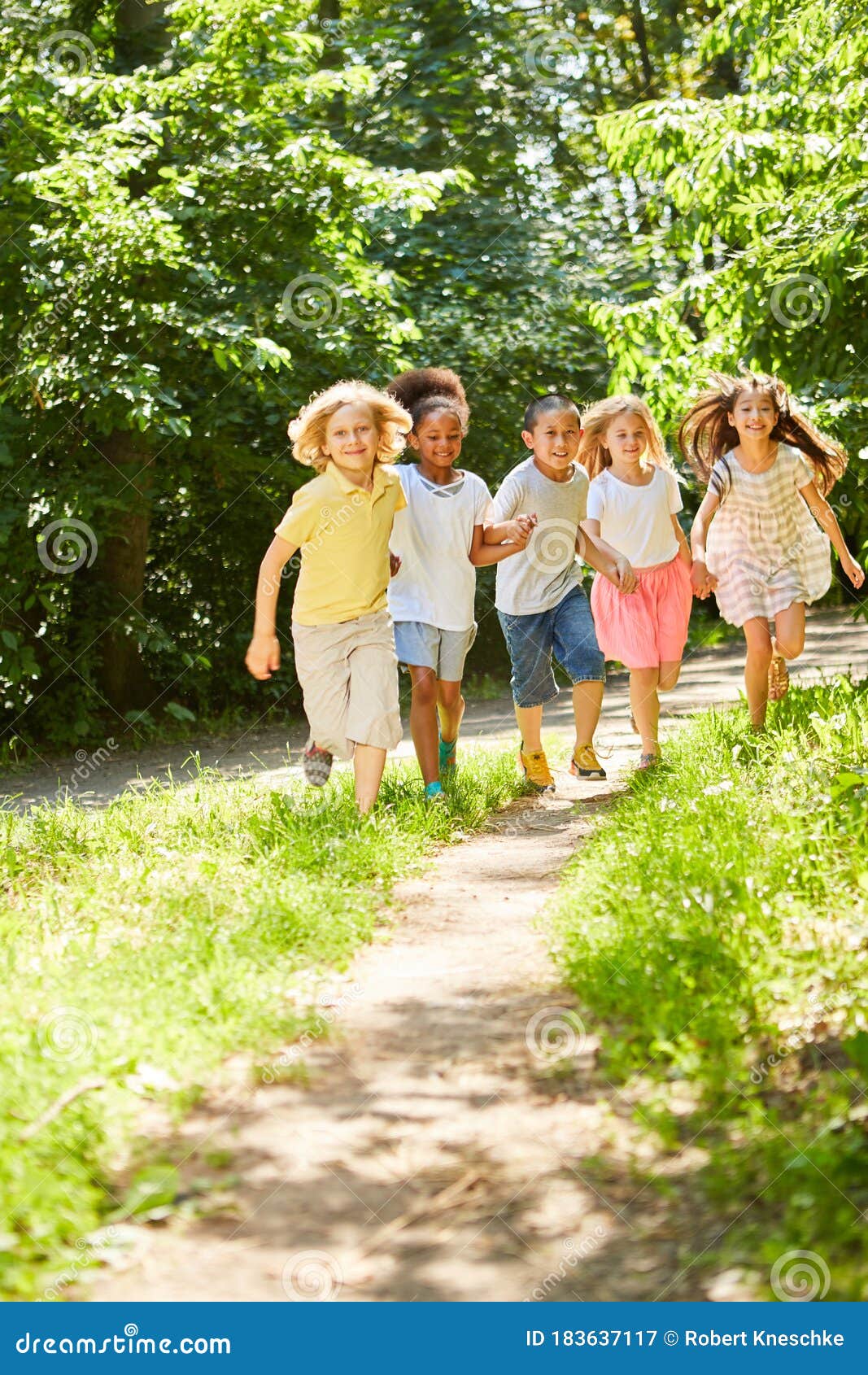 Group of Kids Running Together Over Meadow Stock Image - Image of park ...