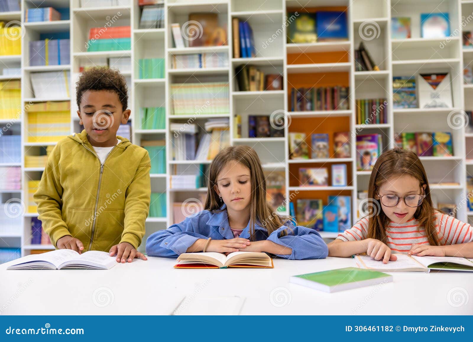 Group of Kids Sitting Studying in Elementary School Library. Stock ...