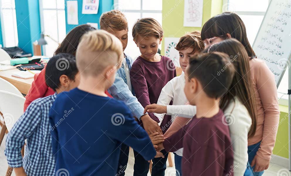 Group of Kids Students with Hands Together at Classroom Stock Image ...