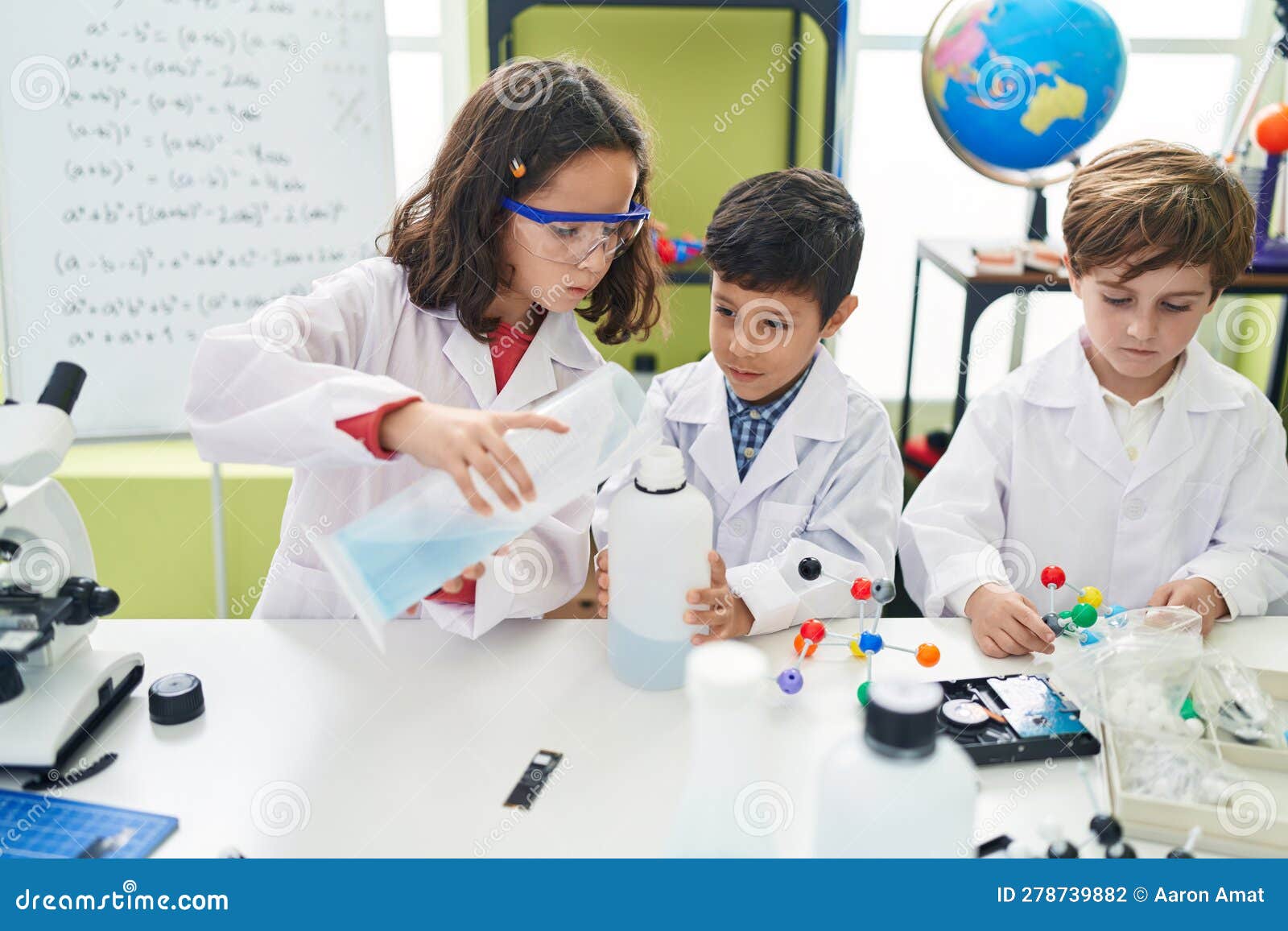 Group of Kids Students Pouring Liquid on Bottl Doing Experiment at ...