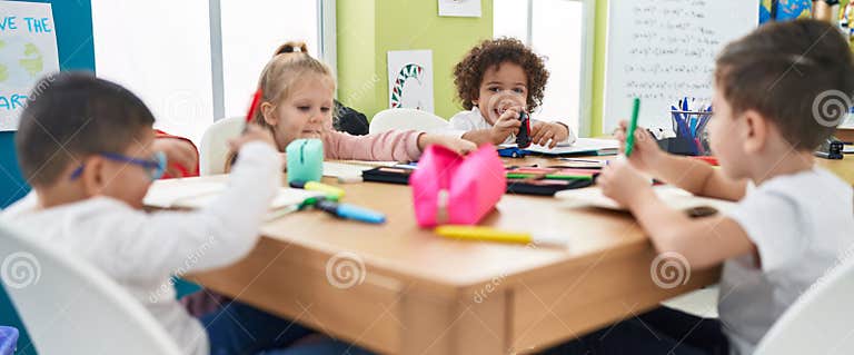 Group of Kids Students Sitting on Table Drawing on Notebook at ...