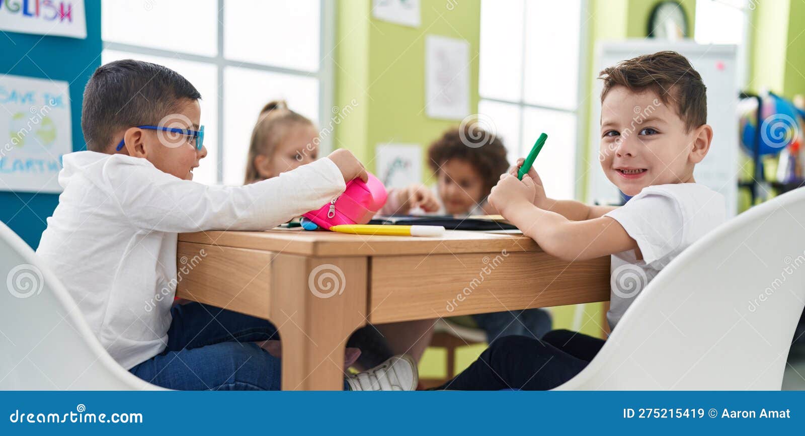 Group of Kids Students Sitting on Table Drawing on Notebook at ... Group of Kids Students Sitting on Table Drawing on Notebook at ...