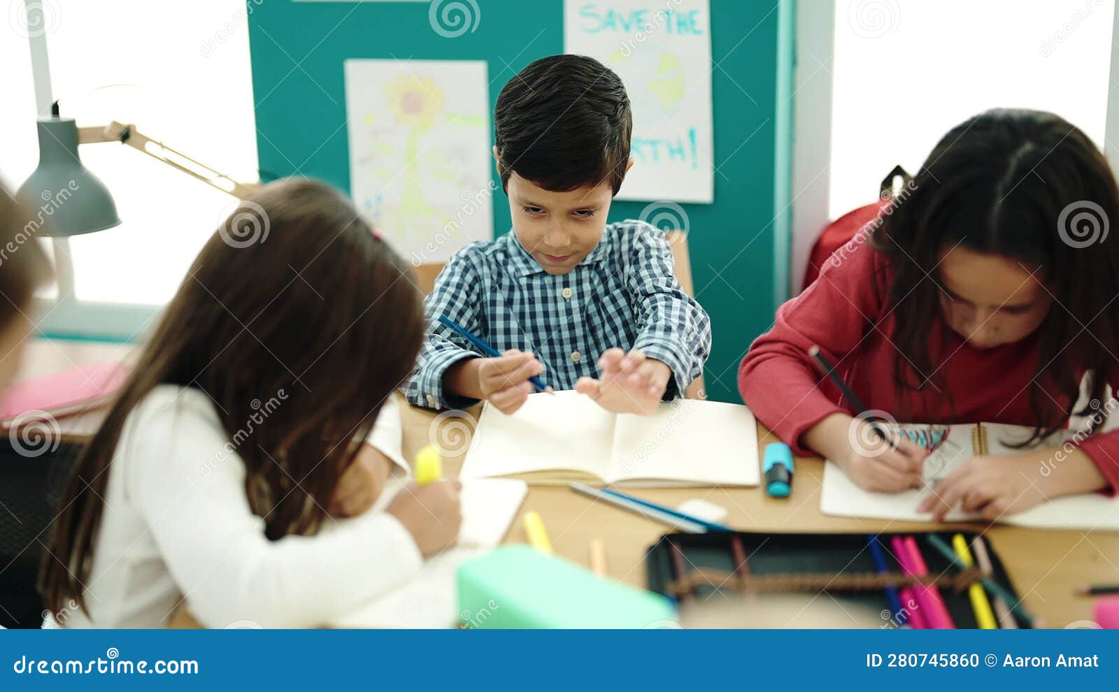 Group of Kids Students Sitting on Table Drawing on Notebook at ...