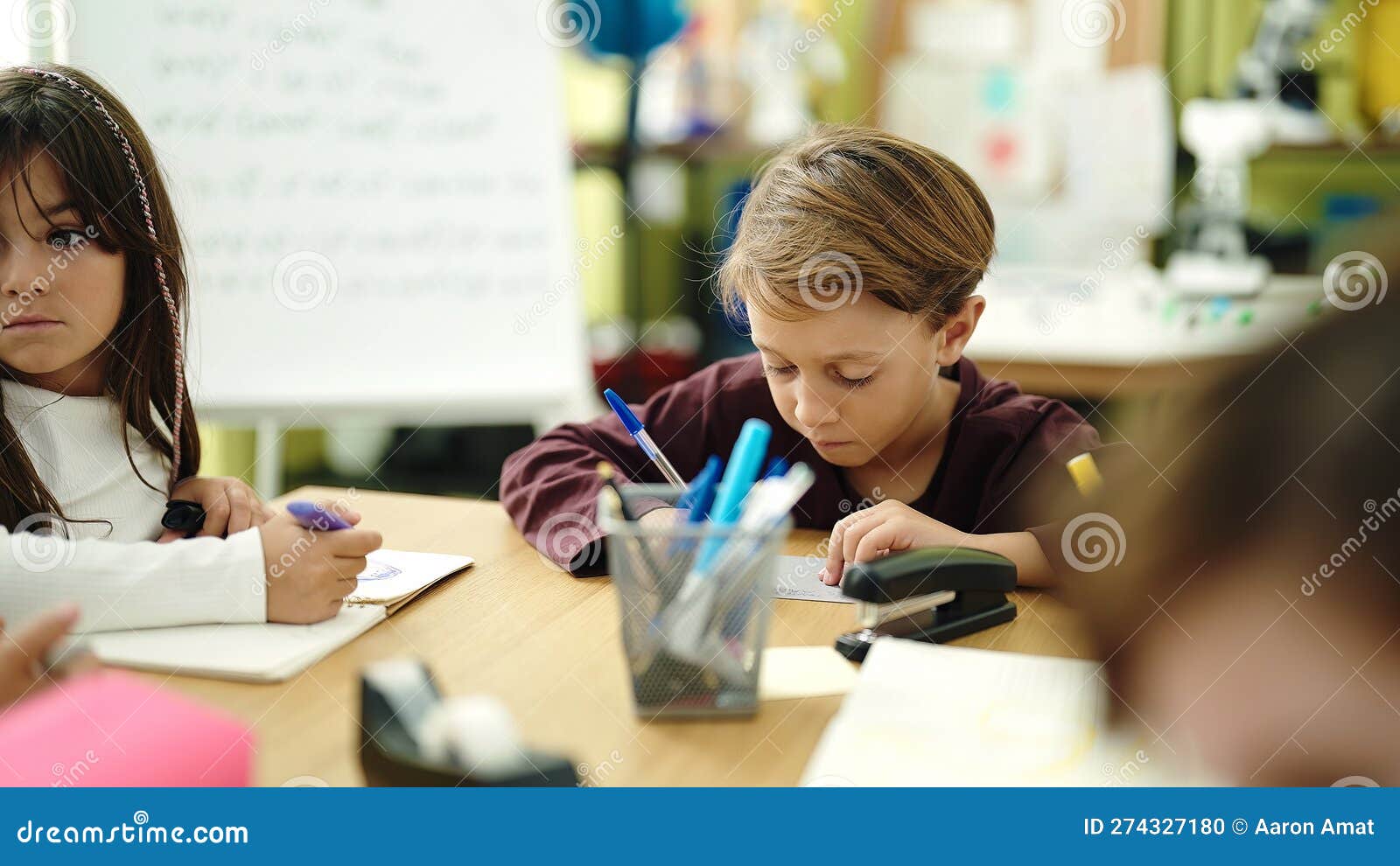 Group of Kids Students Sitting on Table Studying at Classroom Stock ...