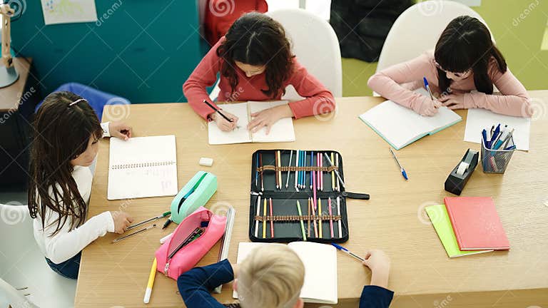 Group of Kids Students Sitting on Table Studying at Classroom Stock ...