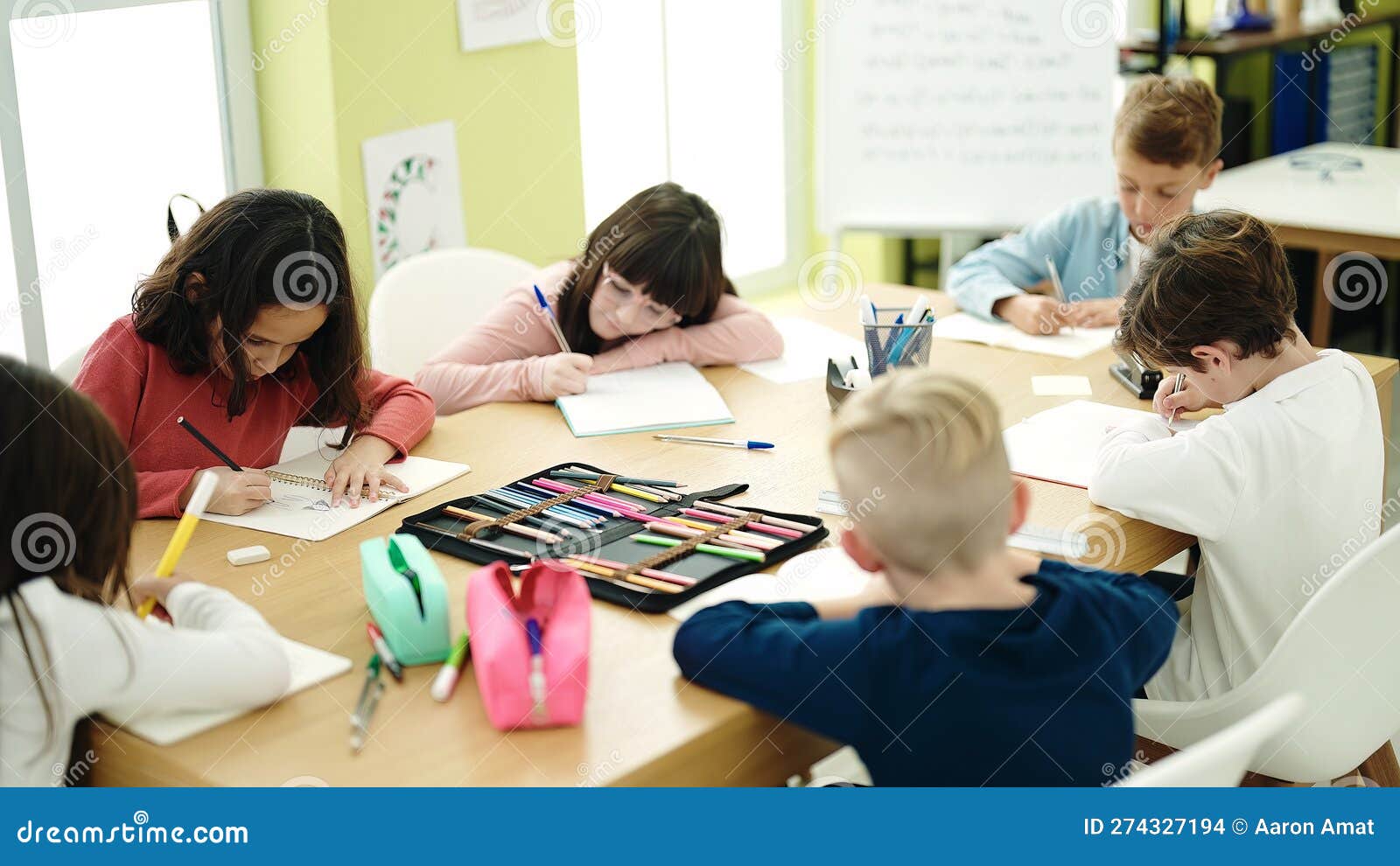 Group of Kids Students Sitting on Table Studying at Classroom Stock ...