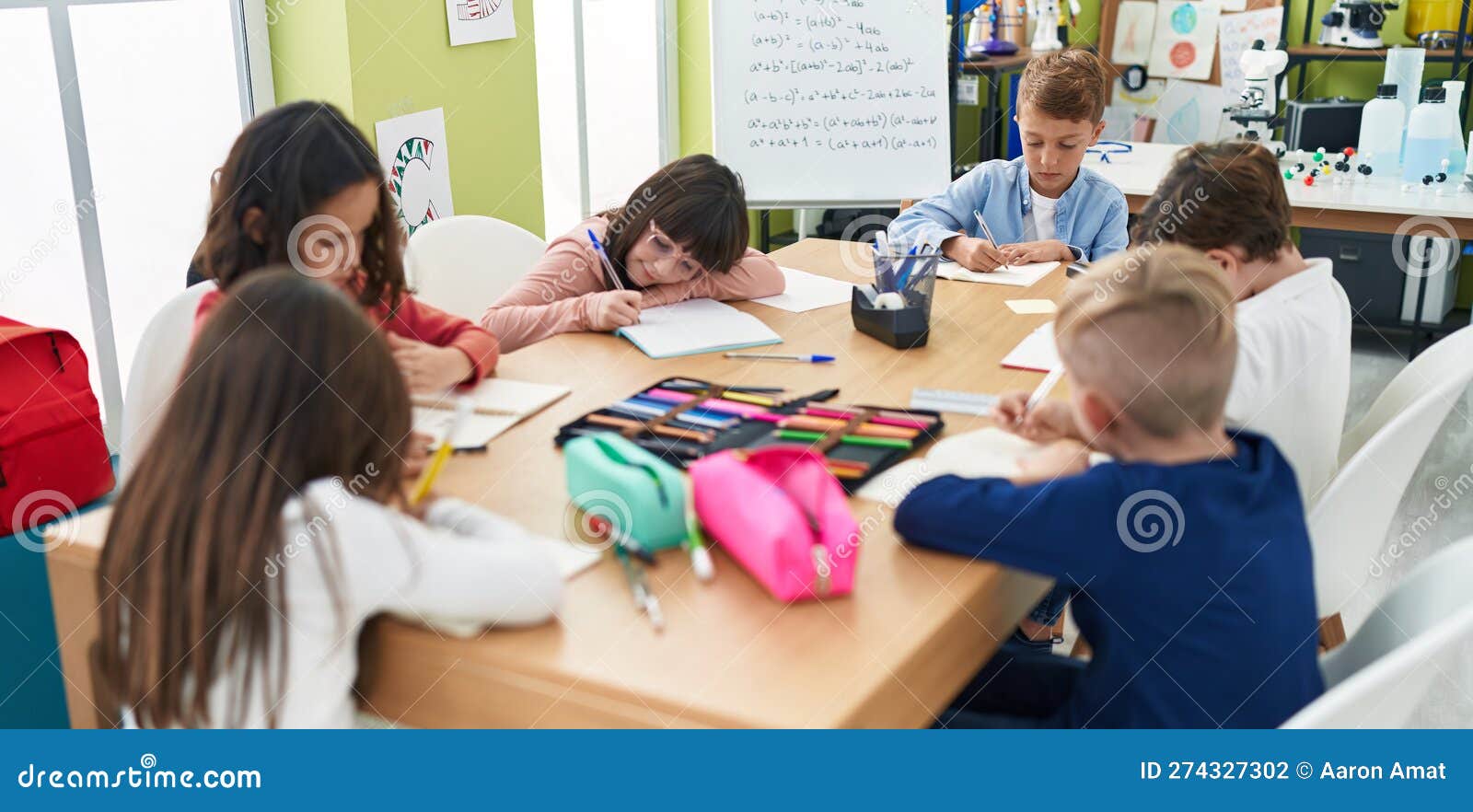Group of Kids Students Sitting on Table Studying at Classroom Stock ...