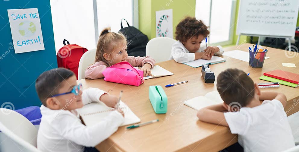 Group of Kids Students Sitting on Table Studying at Classroom Stock ...