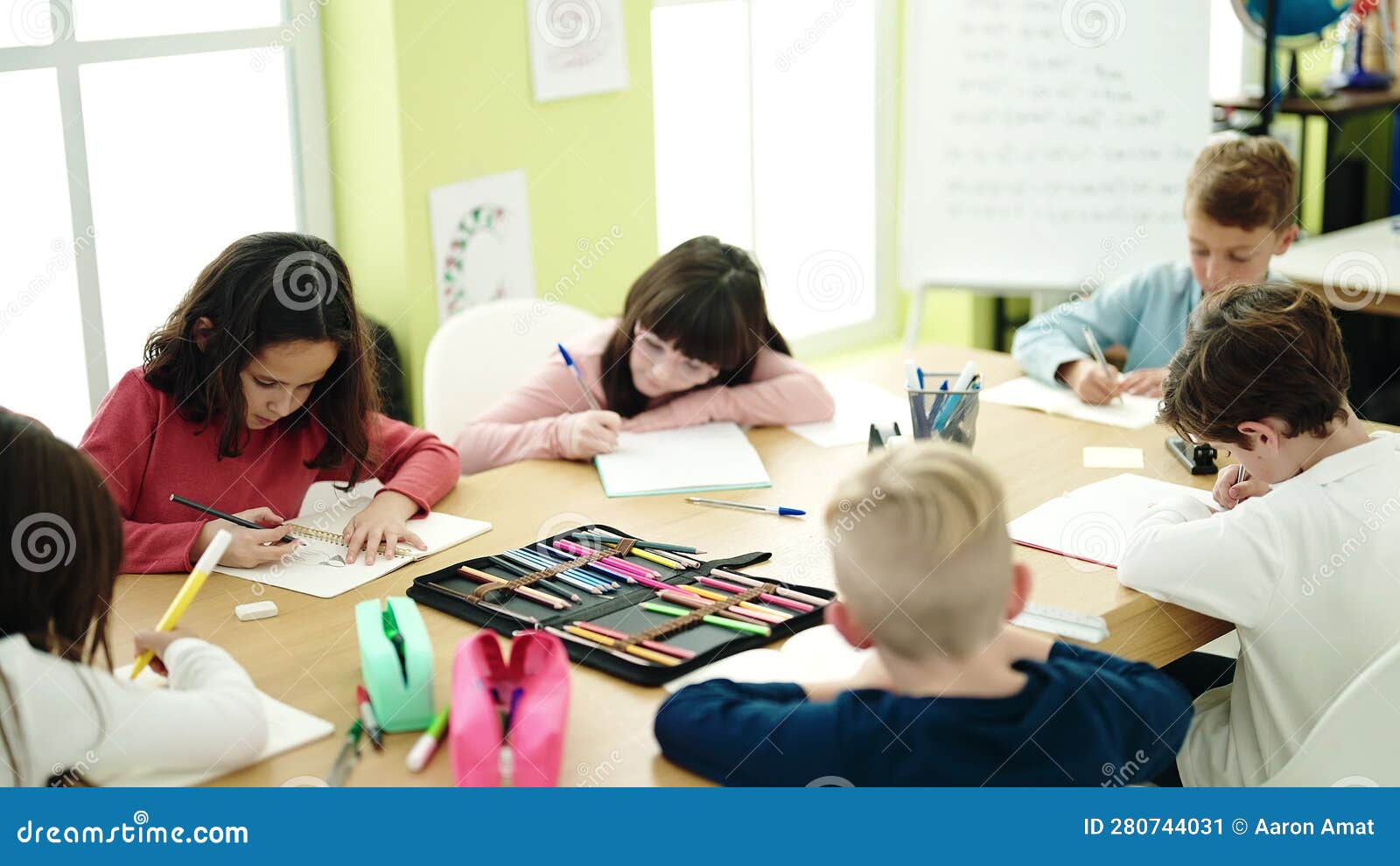 Group of Kids Students Sitting on Table Studying at Classroom Stock ...