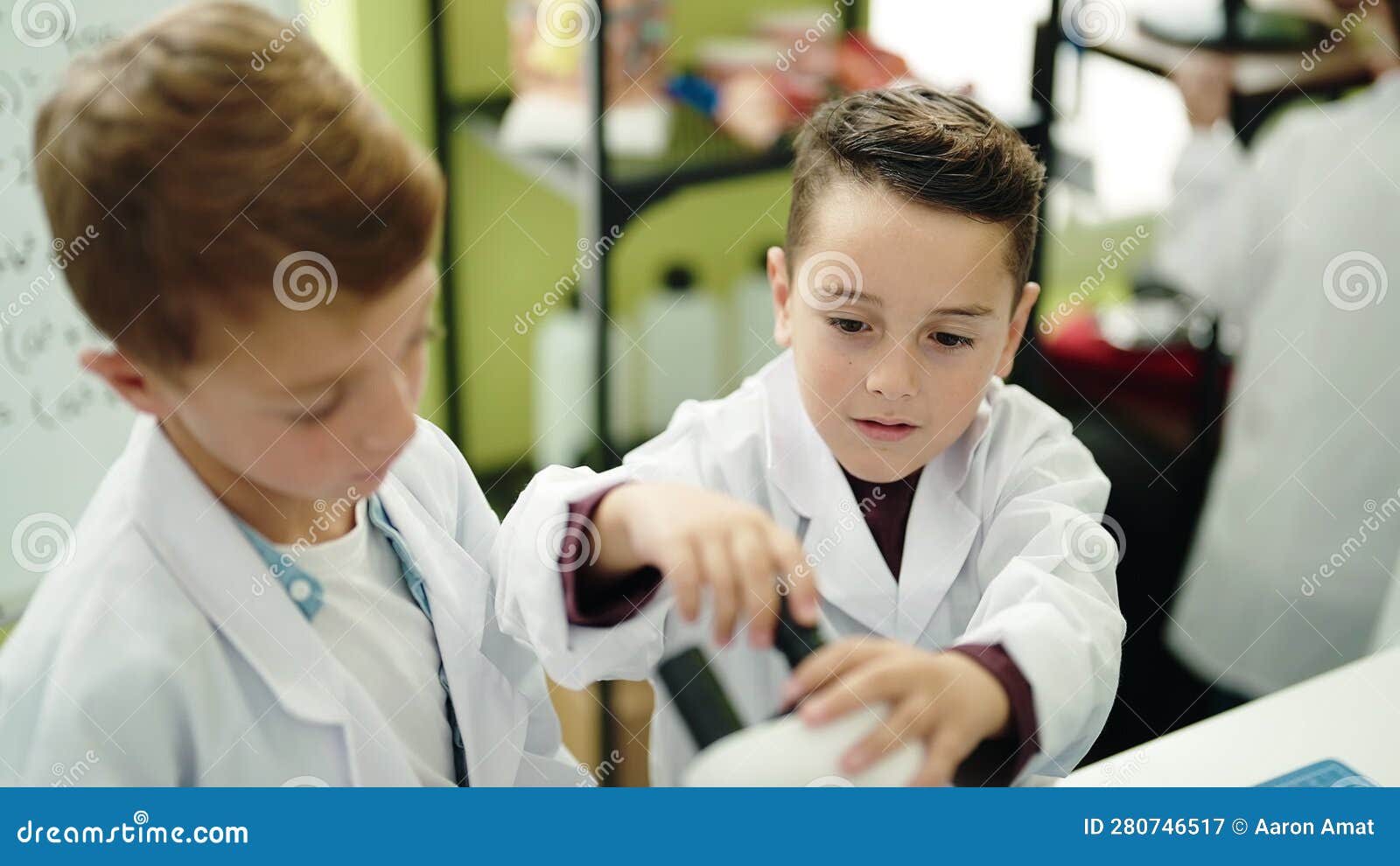Group of Kids Students Using Microscope Holding Smartphone at ...