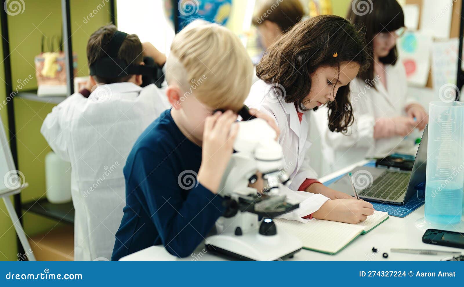 Group of Kids Students Using Microscope at Laboratory Classroom Stock ...